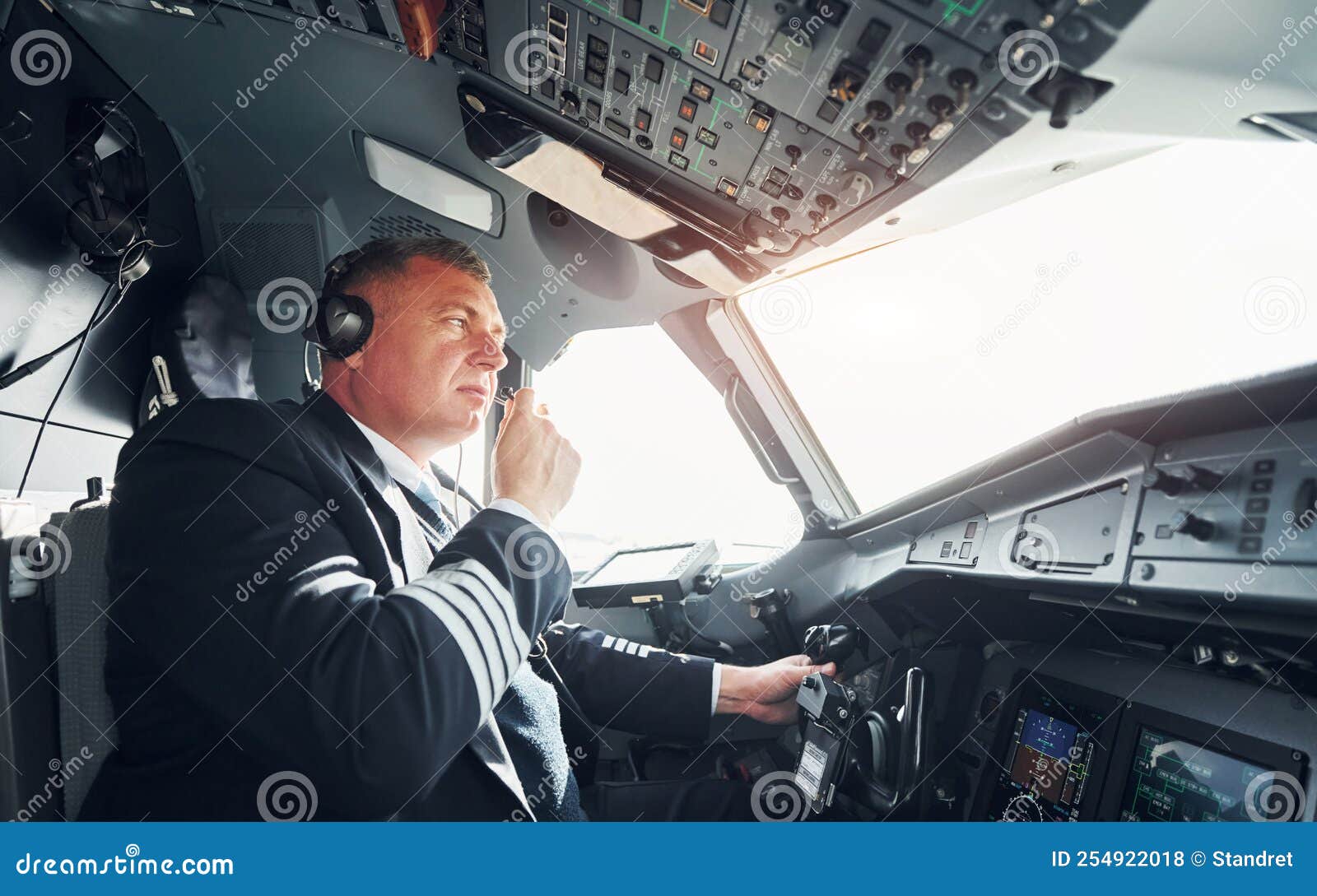 Side View. a Professional Pilot is in the Cockpit Stock Photo - Image ...