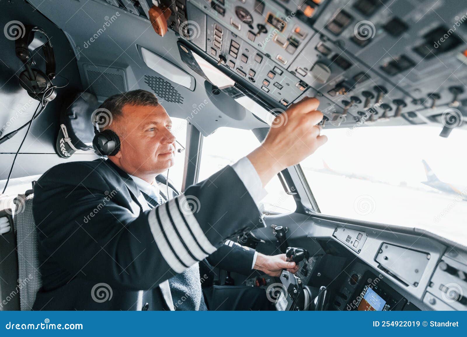 Side View. a Professional Pilot is in the Cockpit Stock Image - Image ...