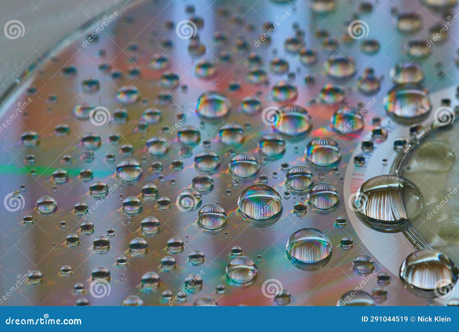Side View of Rainbow Water Drops in Macro View of Metallic Surface ...