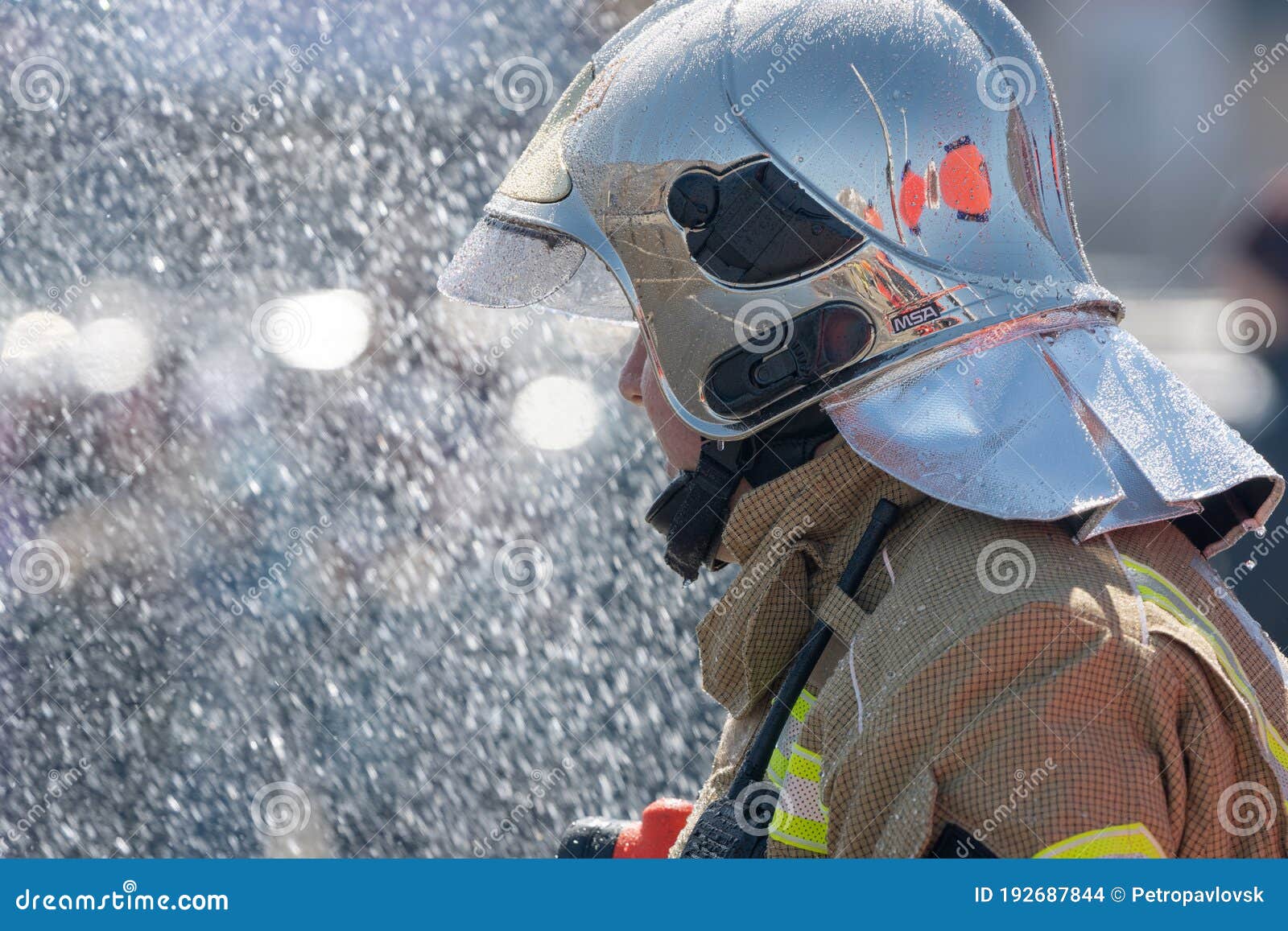 Side View of Rescuer in Silver Mirrored Helmet and Protective Uniform ...