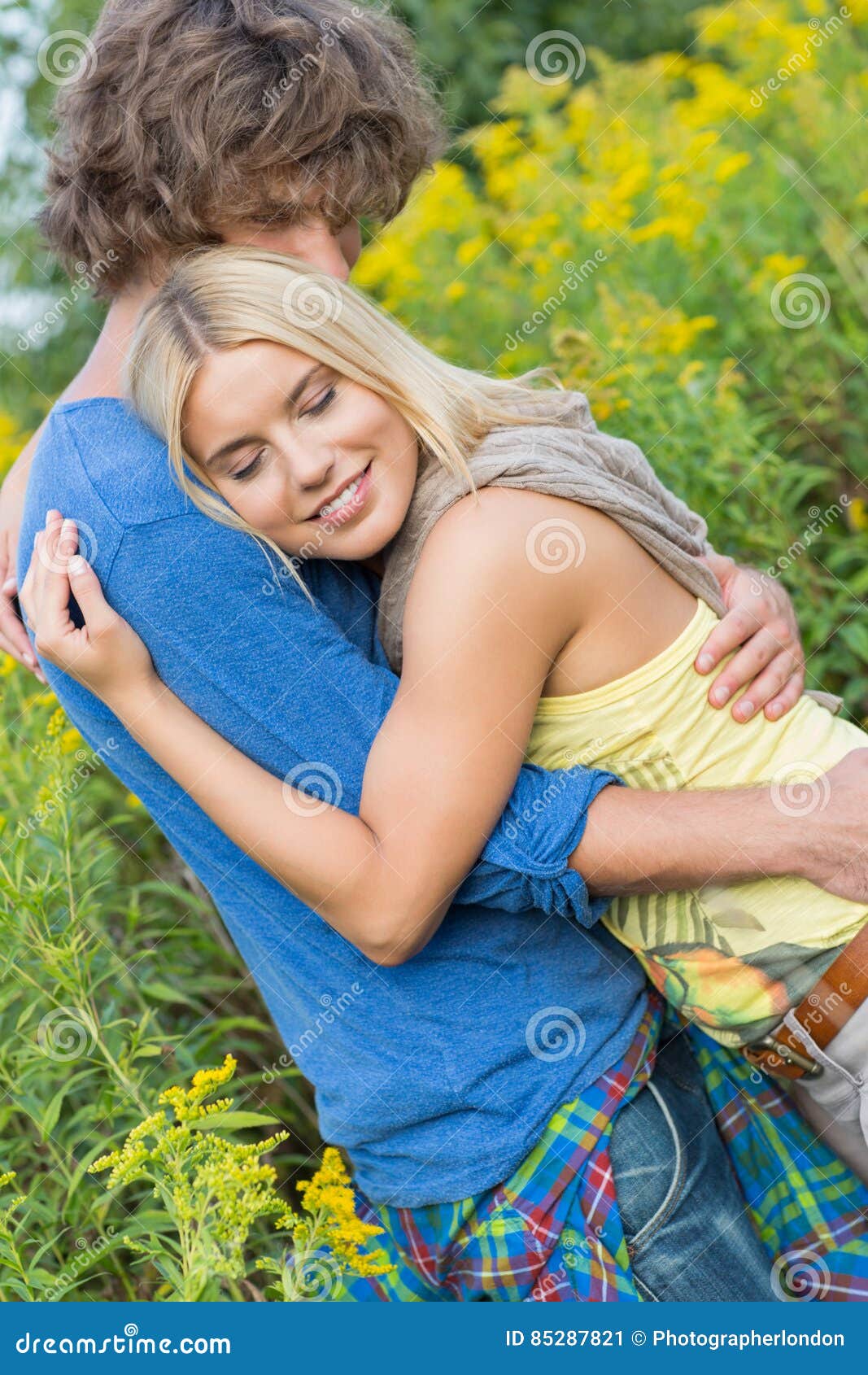 Side View of Romantic Couple Hugging in Field Stock Image - Image of ...