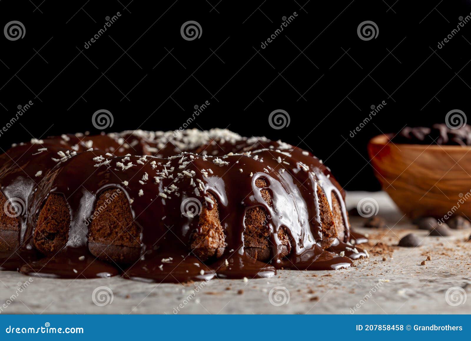Side View of a Round Chocolate Cake with Melted Pudding Icing and ...