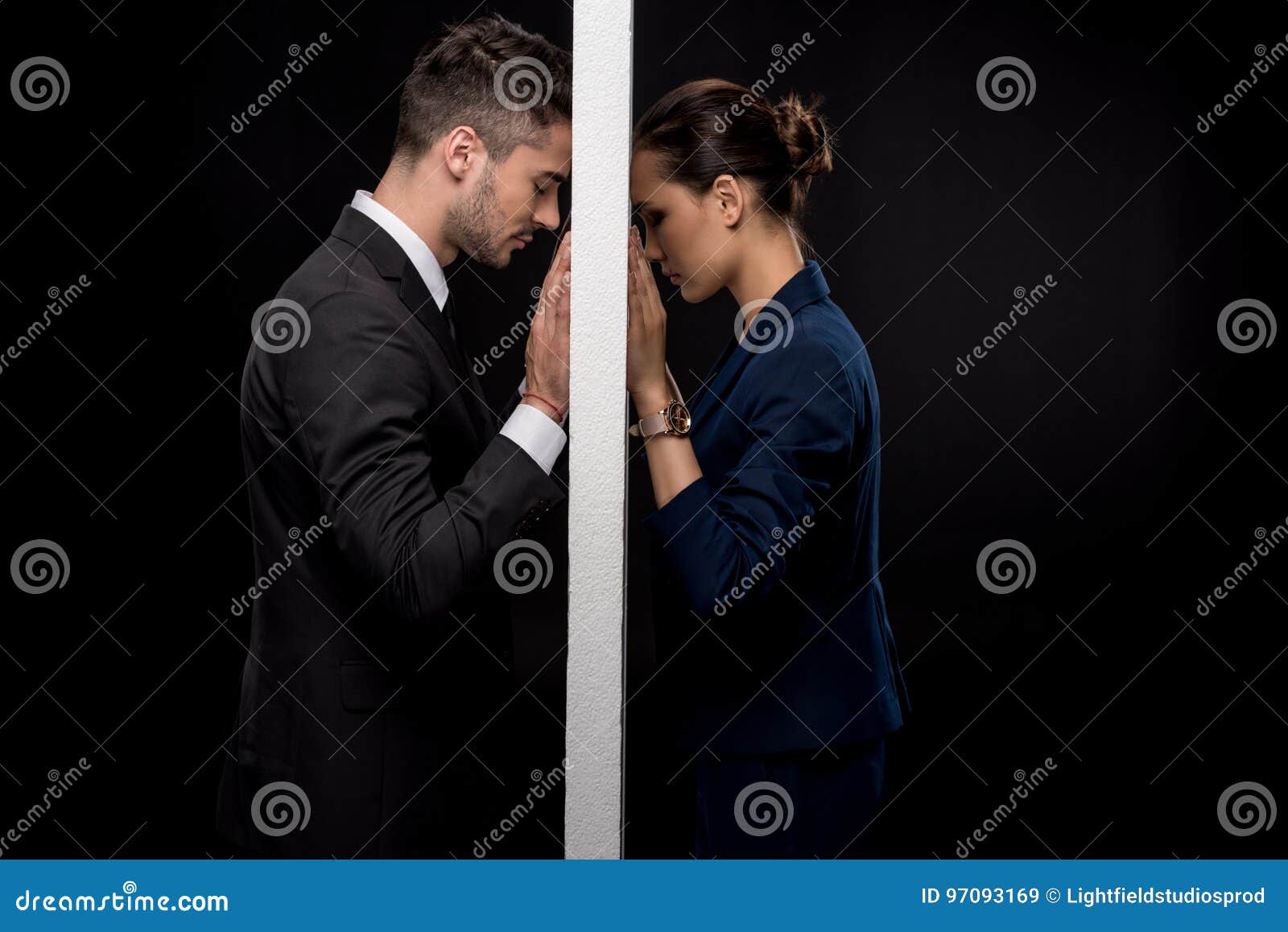 Side View of Sad Couple in Formal Wear Separated by Wall Stock Image ...