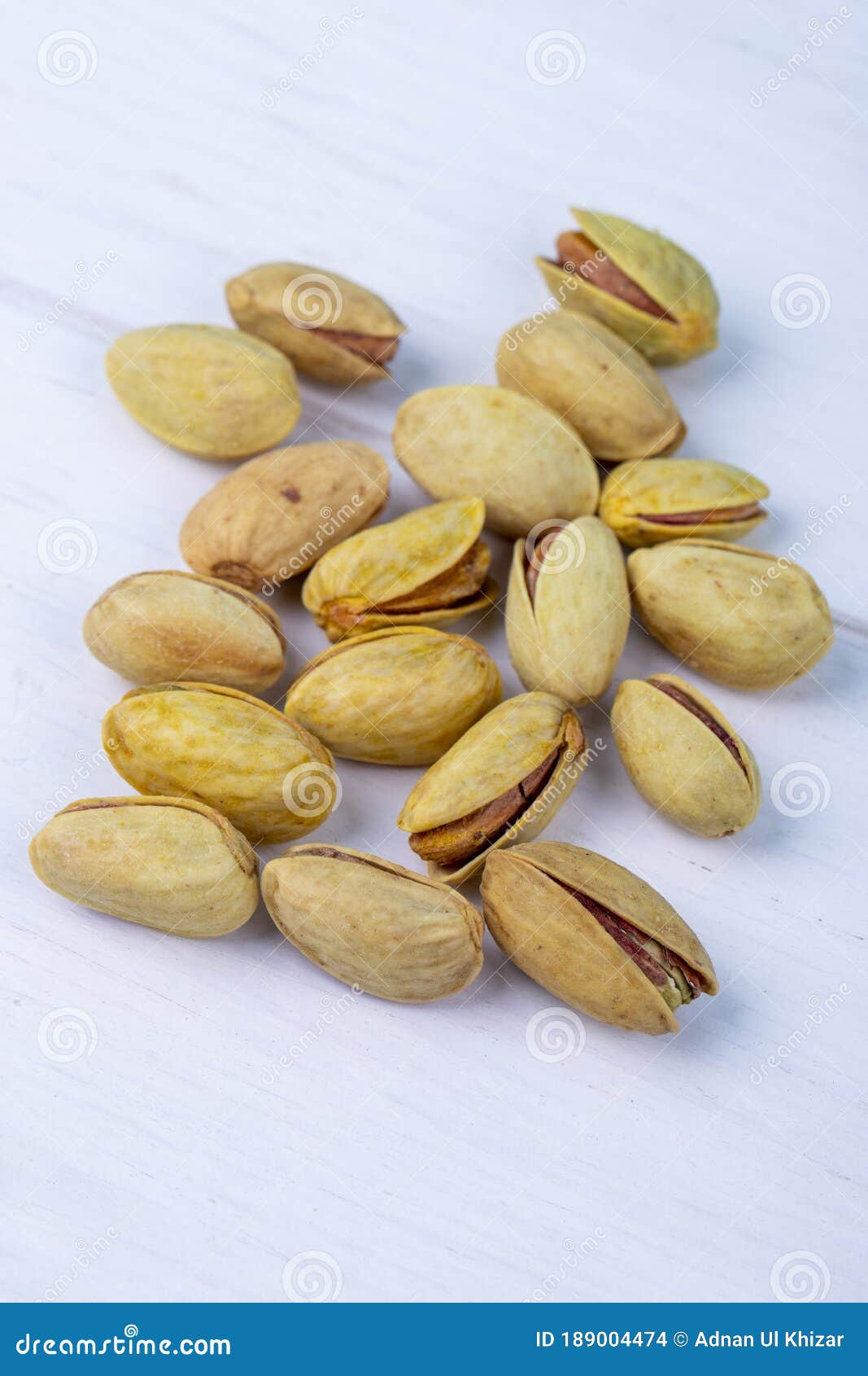 Side View of Salted Roasted Pistachios on White Background Stock Photo ...