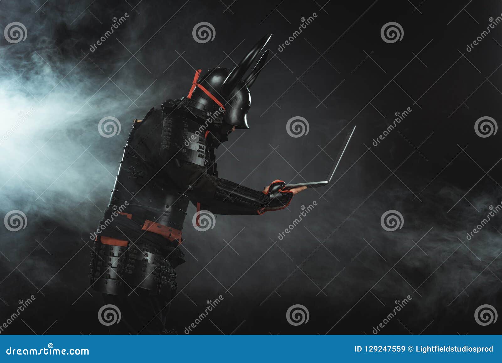 Side View of of Samurai Using Laptop on Dark Background Stock Image ...