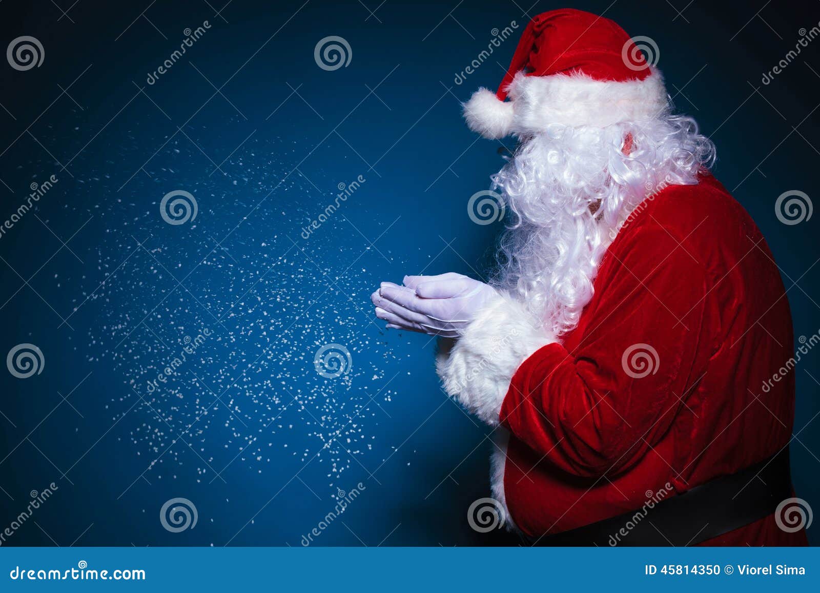 Side View of Santa Claus Blowing Snow Stock Photo - Image of clothes ...