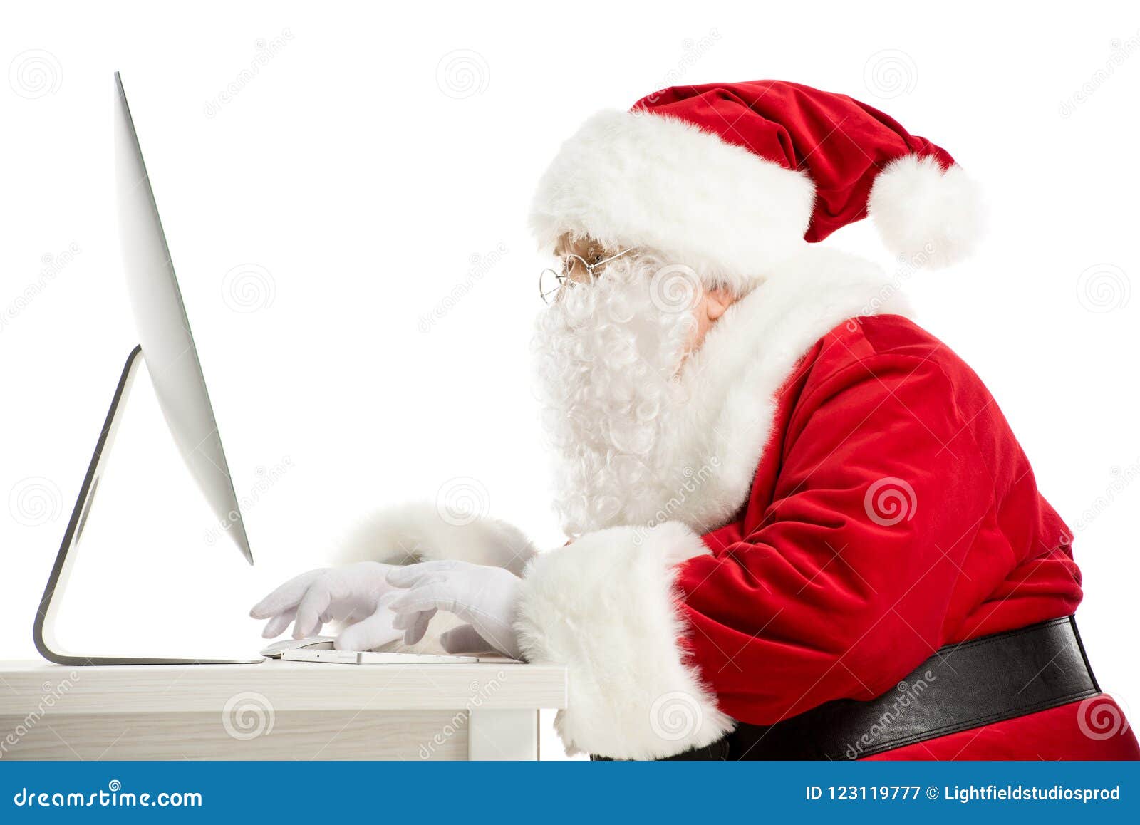 Santa Claus using computer stock image. Image of holiday - 123119777