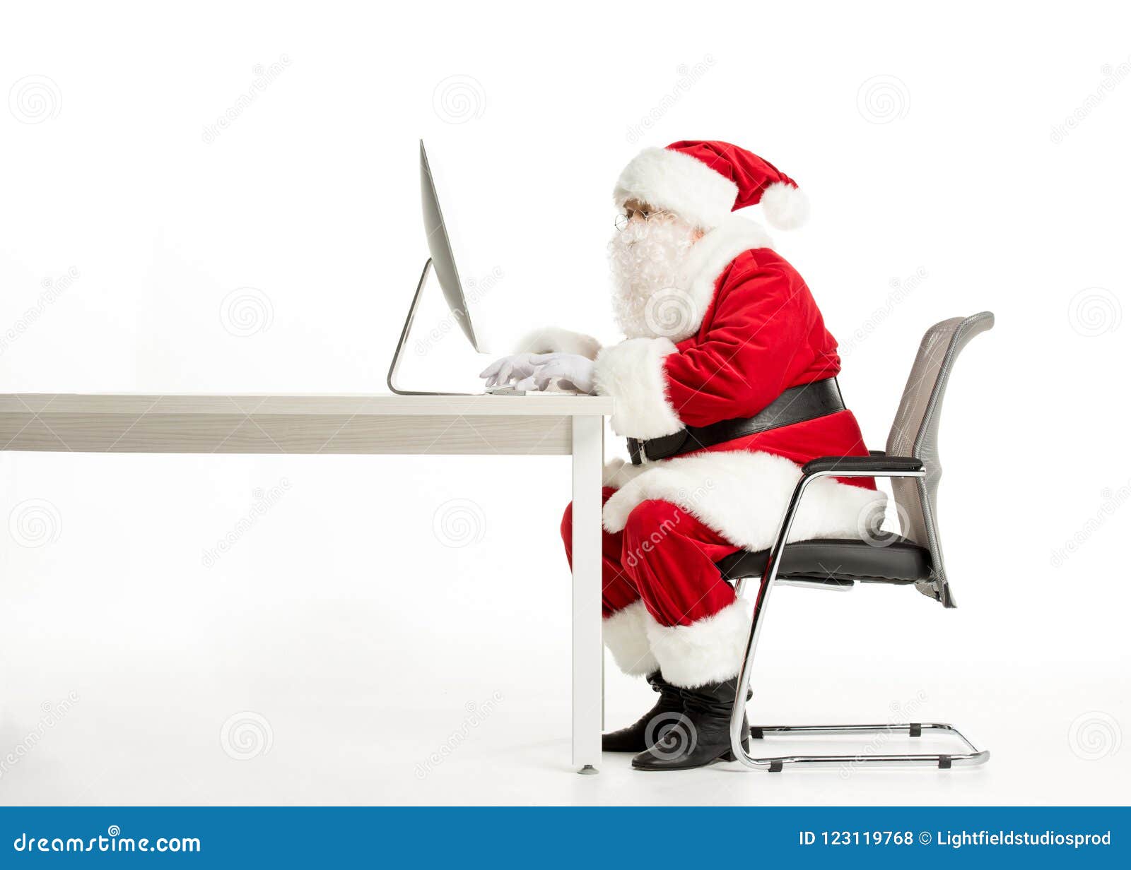 Santa Claus using computer stock photo. Image of christmastime - 123119768