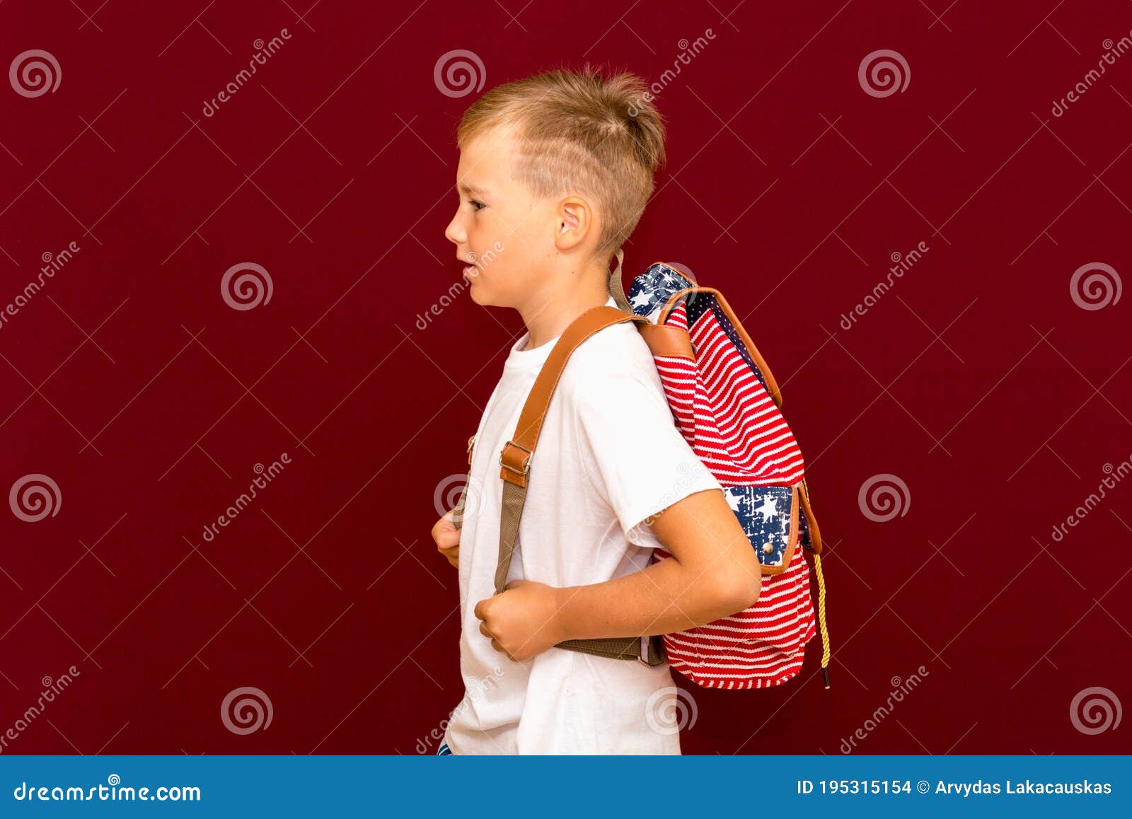 Side View of School Boy with Backpack, on Red Wall Stock Photo - Image ...