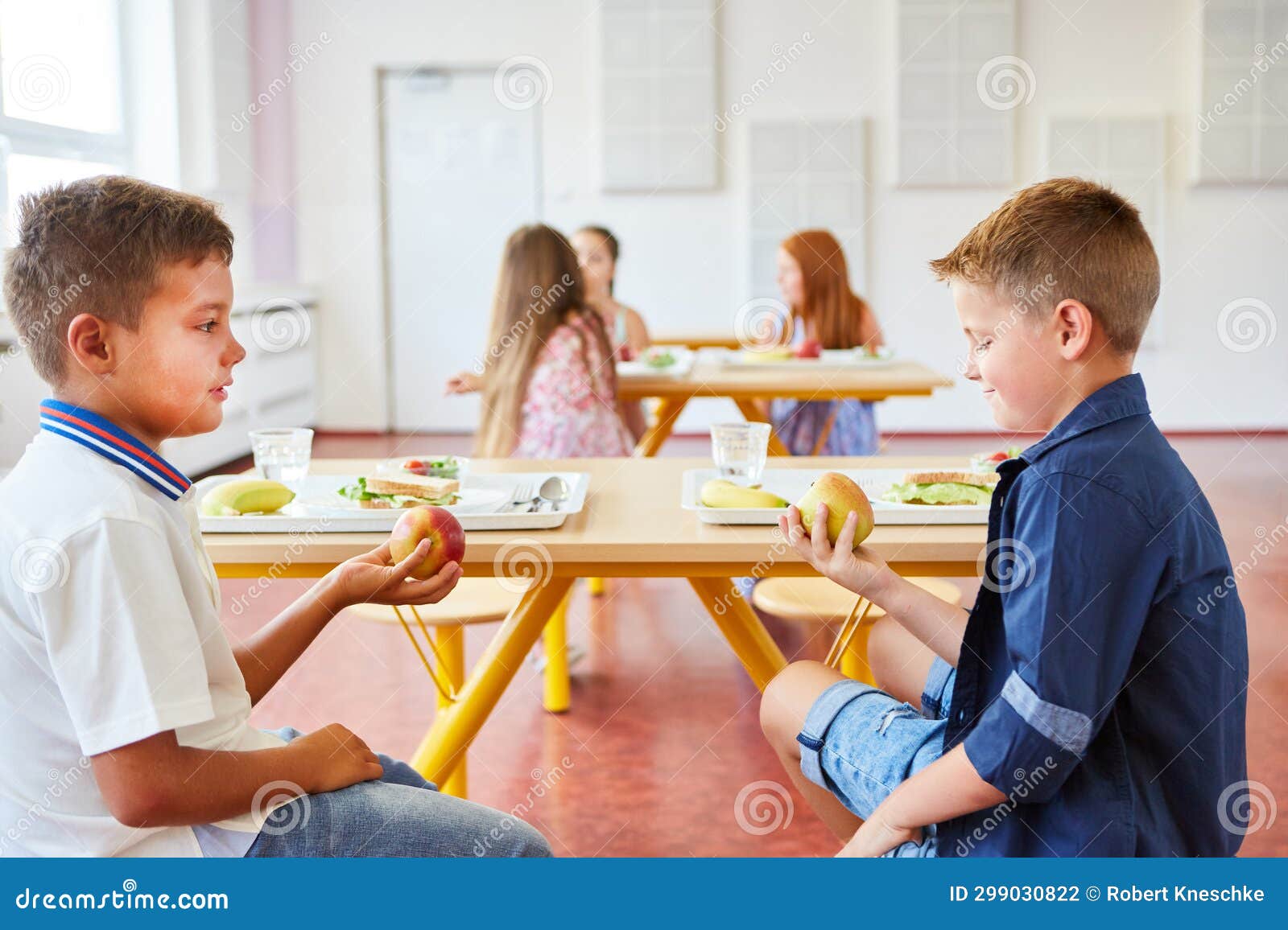 Schoolboys Holding Apples and Talking during Lunch Time Stock Photo ...