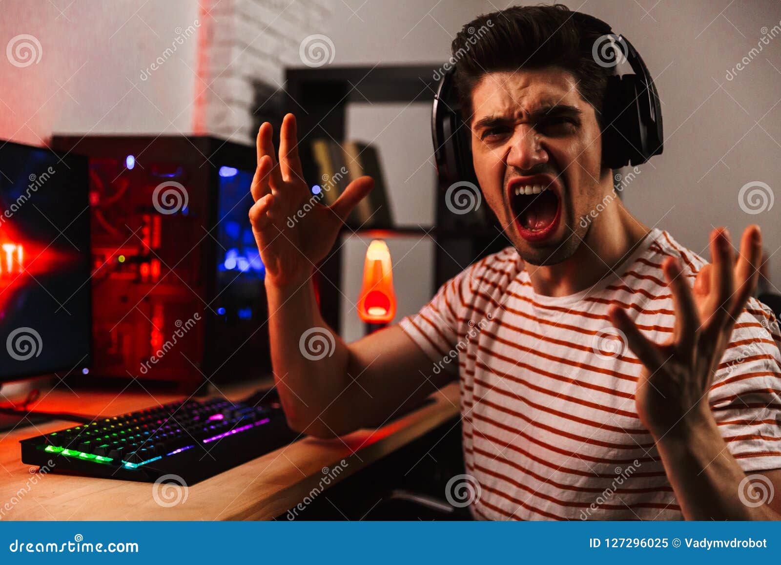Side View of Screaming Gamer Playing Video Games on Computer Stock ...