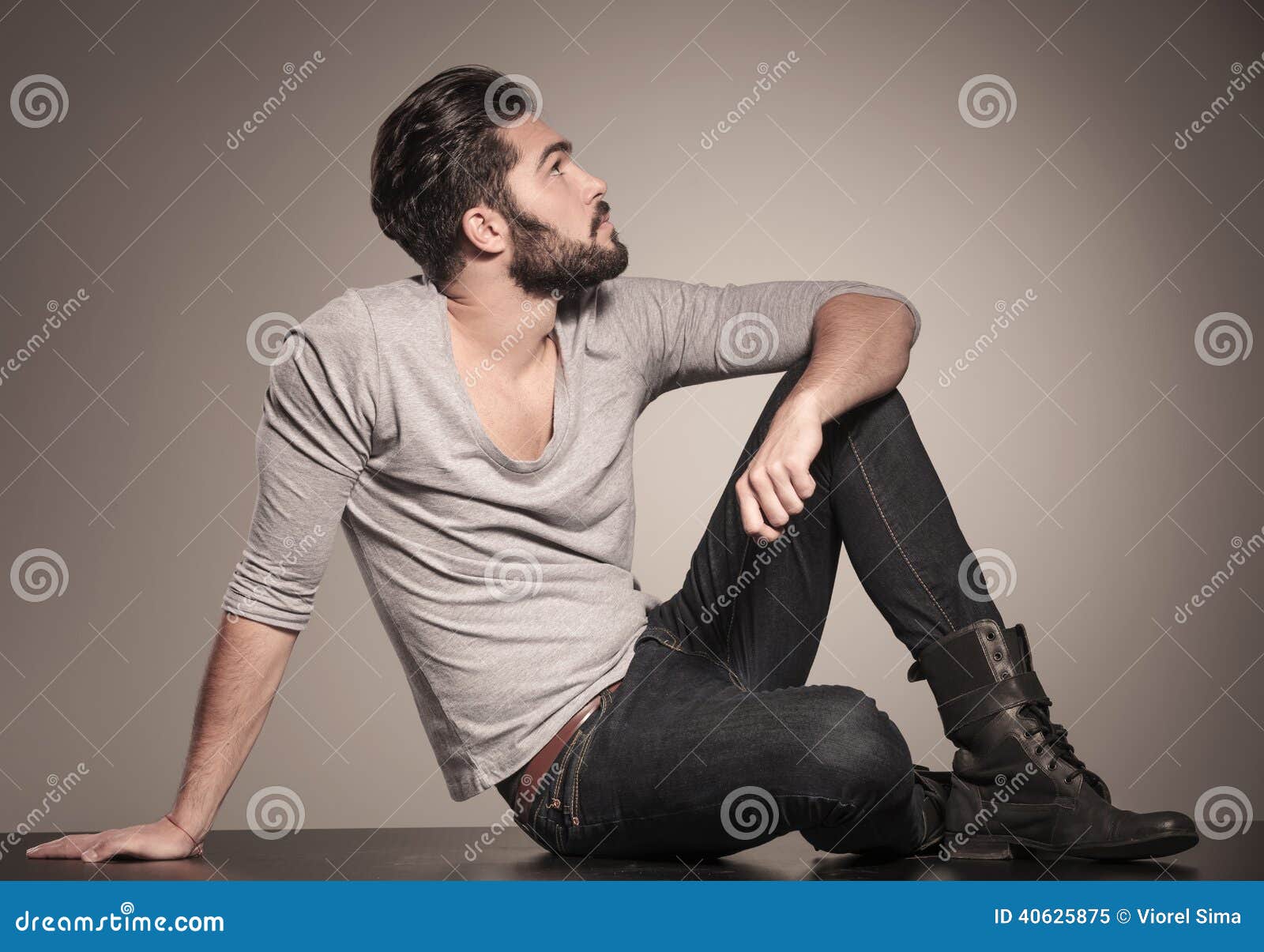 Side View of a Seated Man Looking Up Stock Image - Image of pose, hand ...