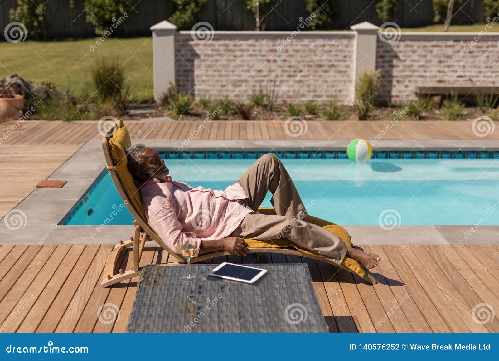 Senior Man Sleeping on a Sun Lounger in the Backyard Stock Photo ... Senior Man Sleeping on a Sun Lounger in the Backyard Stock Photo ...