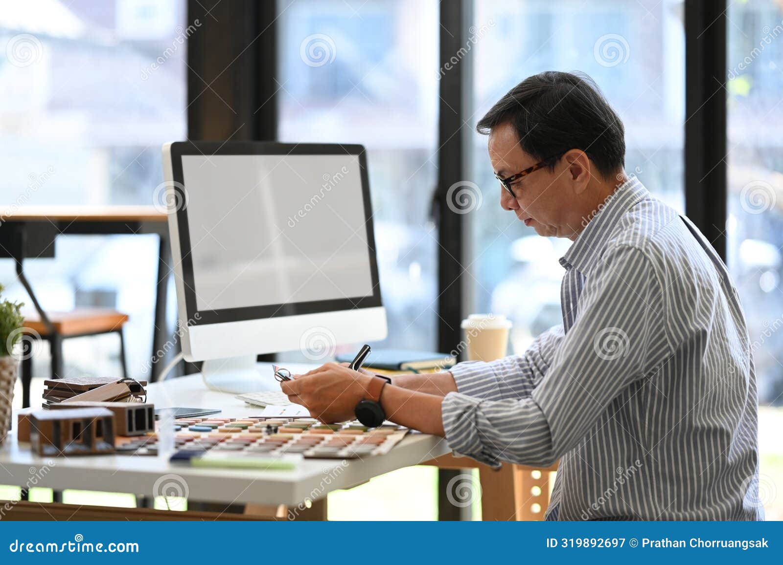 Side View Senior Architect Working on New Design Project in the Modern ...