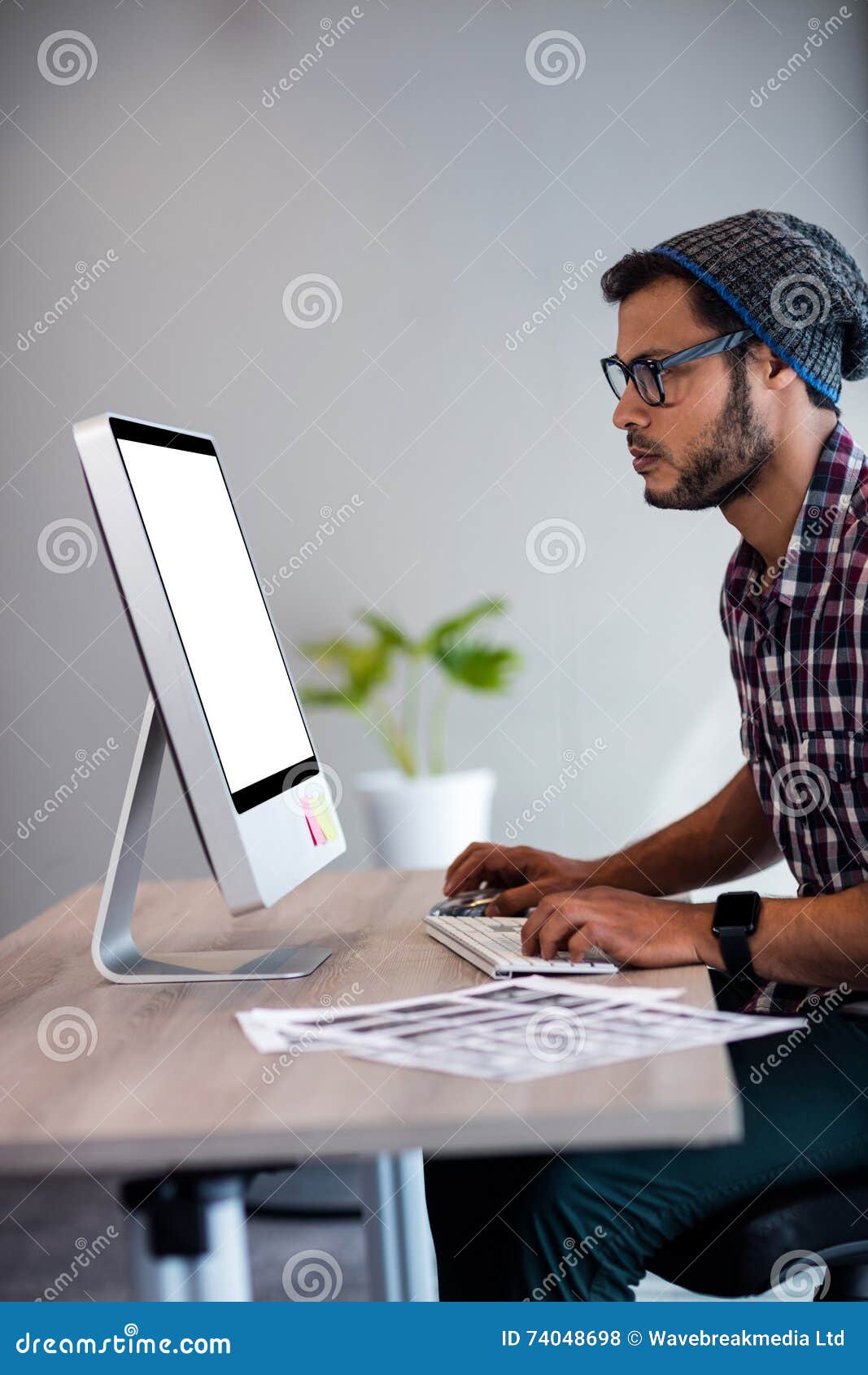 Side View of Serious Casual Man Working at Computer Desk Stock Photo ...