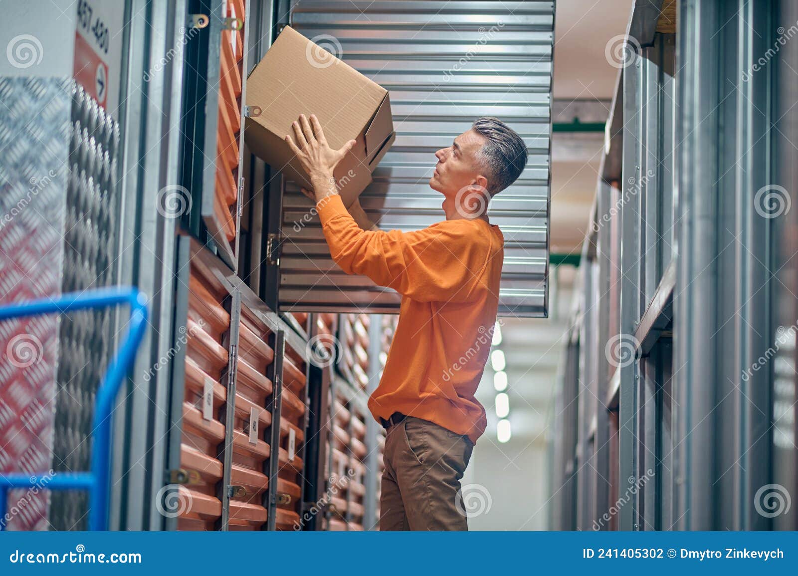 Concentrated Warehouse Worker Unloading Goods Indoors Stock Photo ...