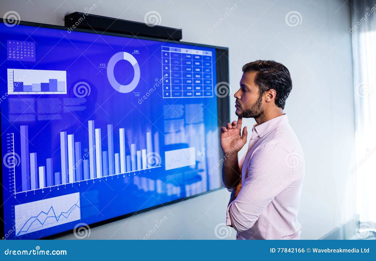 Side View of Serious Man Looking at Graph on a Screen Stock Photo ...