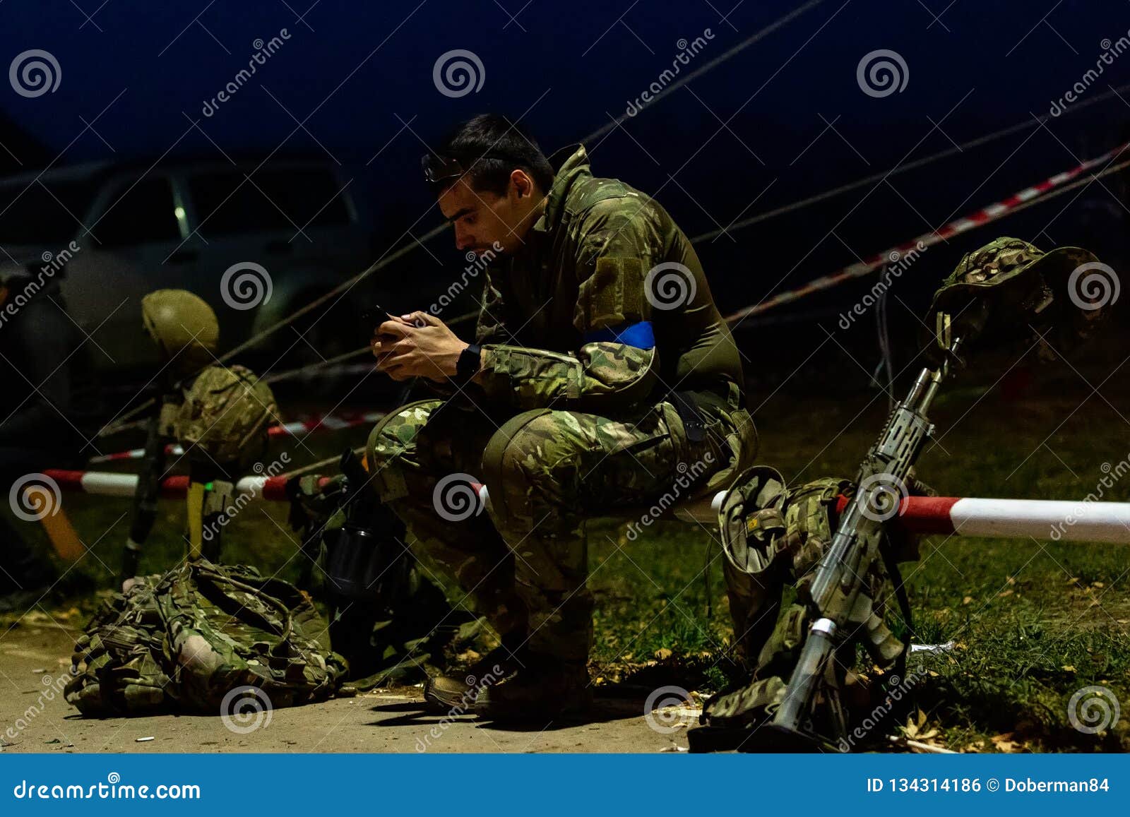 Side View Serious Soldier Writing Message in Phone while Wearing in ...