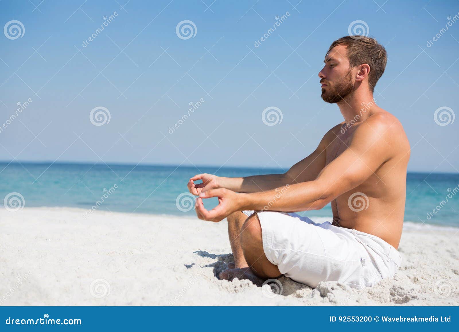 Side View of Shirtless Man Meditating at Beach Stock Photo - Image of ...