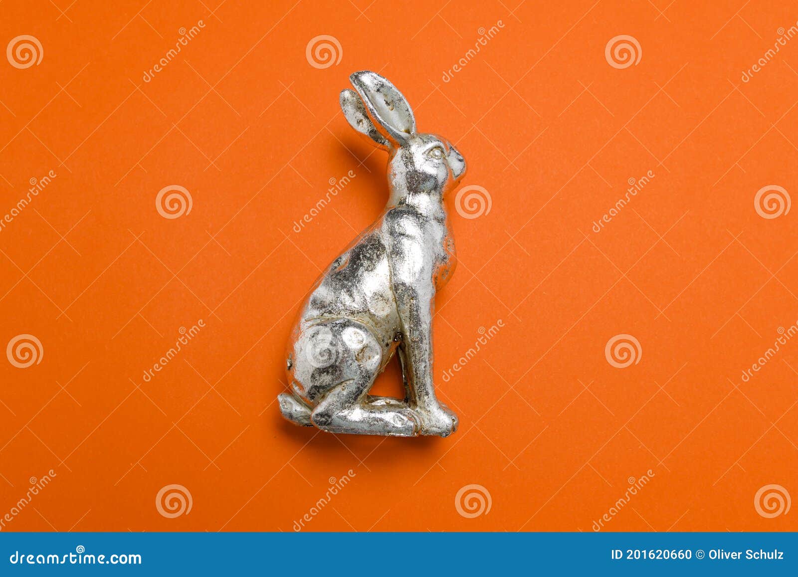 Side View of a Silver Metallic Easter Bunny Figure on a Red Uniform ...