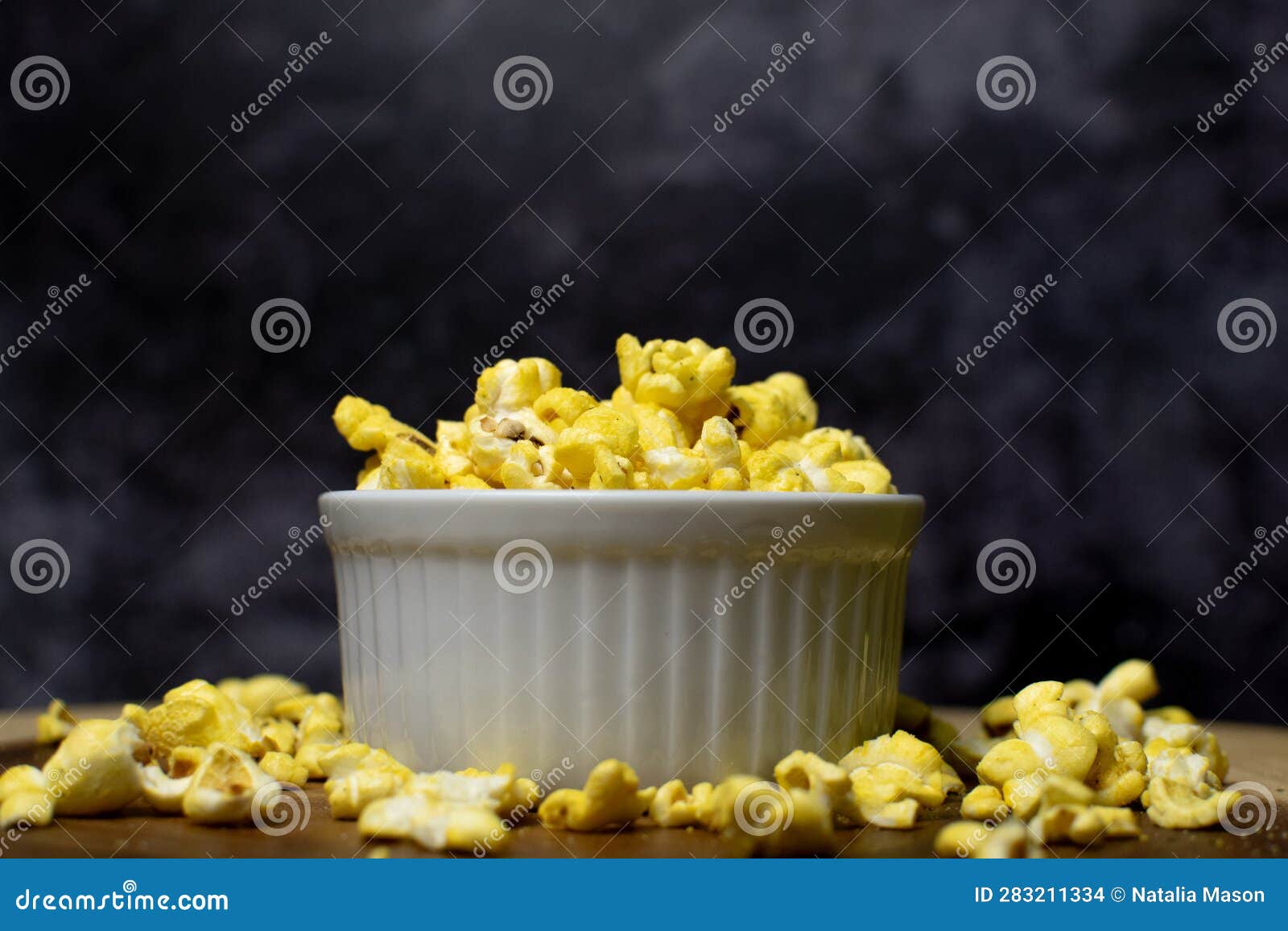 Side View of a Small Bowl of Seasoned Popcorn Stock Photo - Image of ...