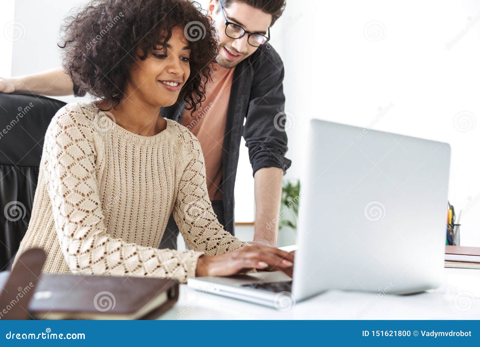 Side View of Smiling African Woman Using Laptop Computer Stock Photo ...