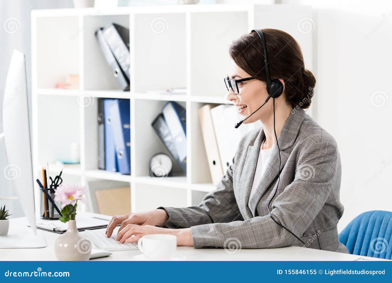 Side View of Smiling Attractive Call Center Operator in Glasses and ...