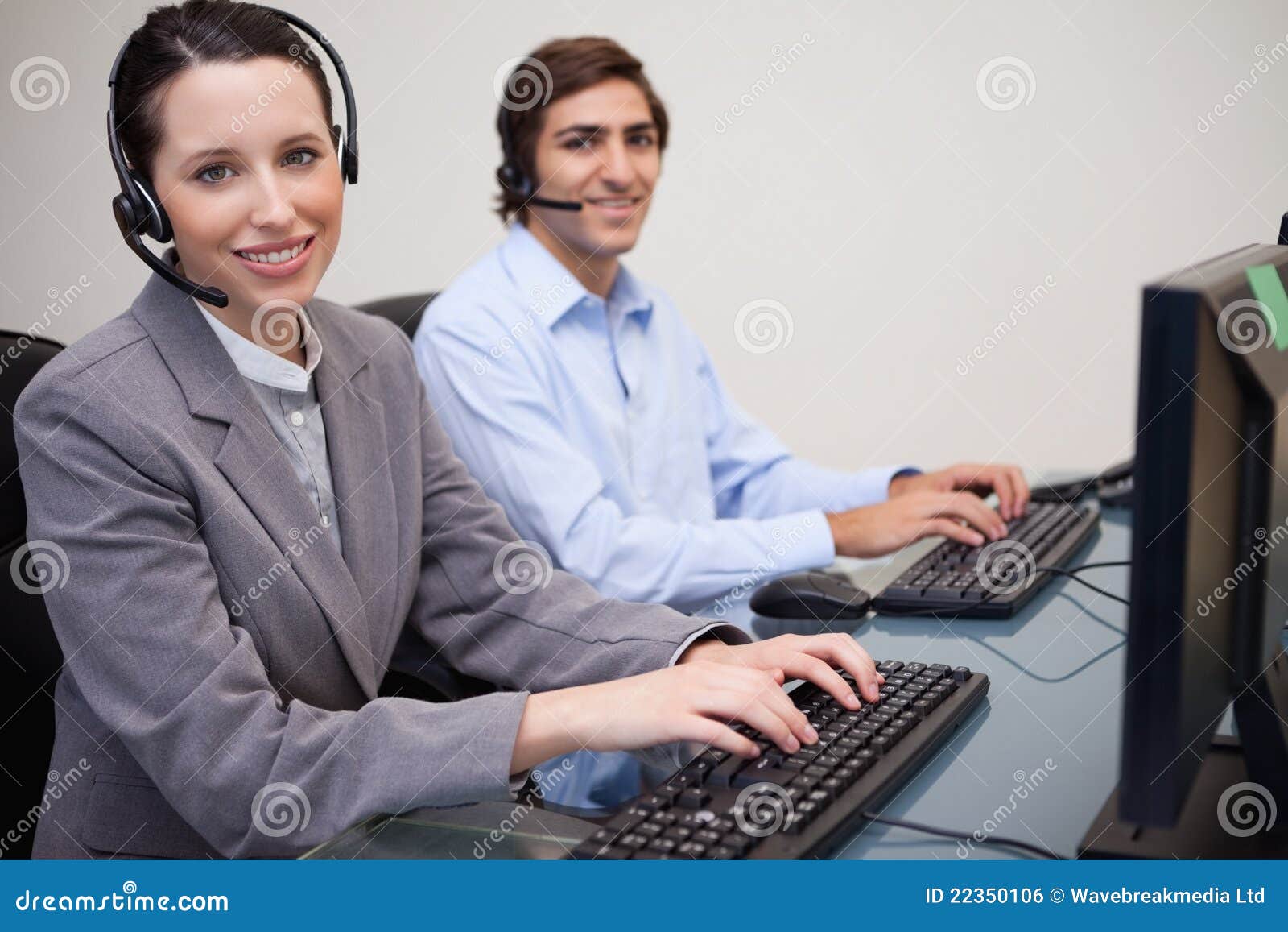 Side View of Smiling Call Center Agents at Work Stock Photo - Image of ...