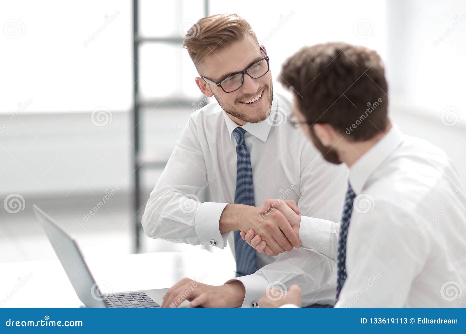 Side View.smiling Employees Shaking Hands Stock Image - Image of person ...