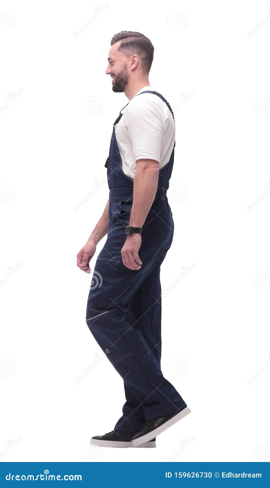 Side View. Smiling Man in Overalls Confidently Striding Forward Stock ...