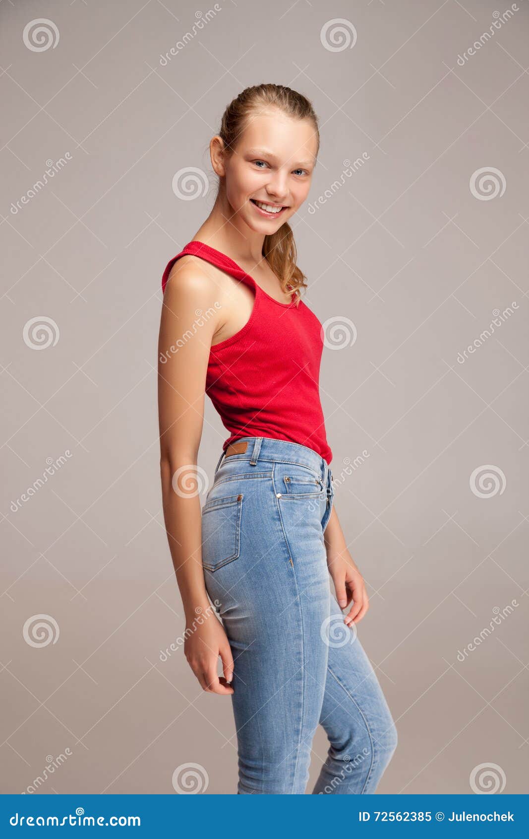 Side View of Smiling Model Looking at Camera Stock Image - Image of ...