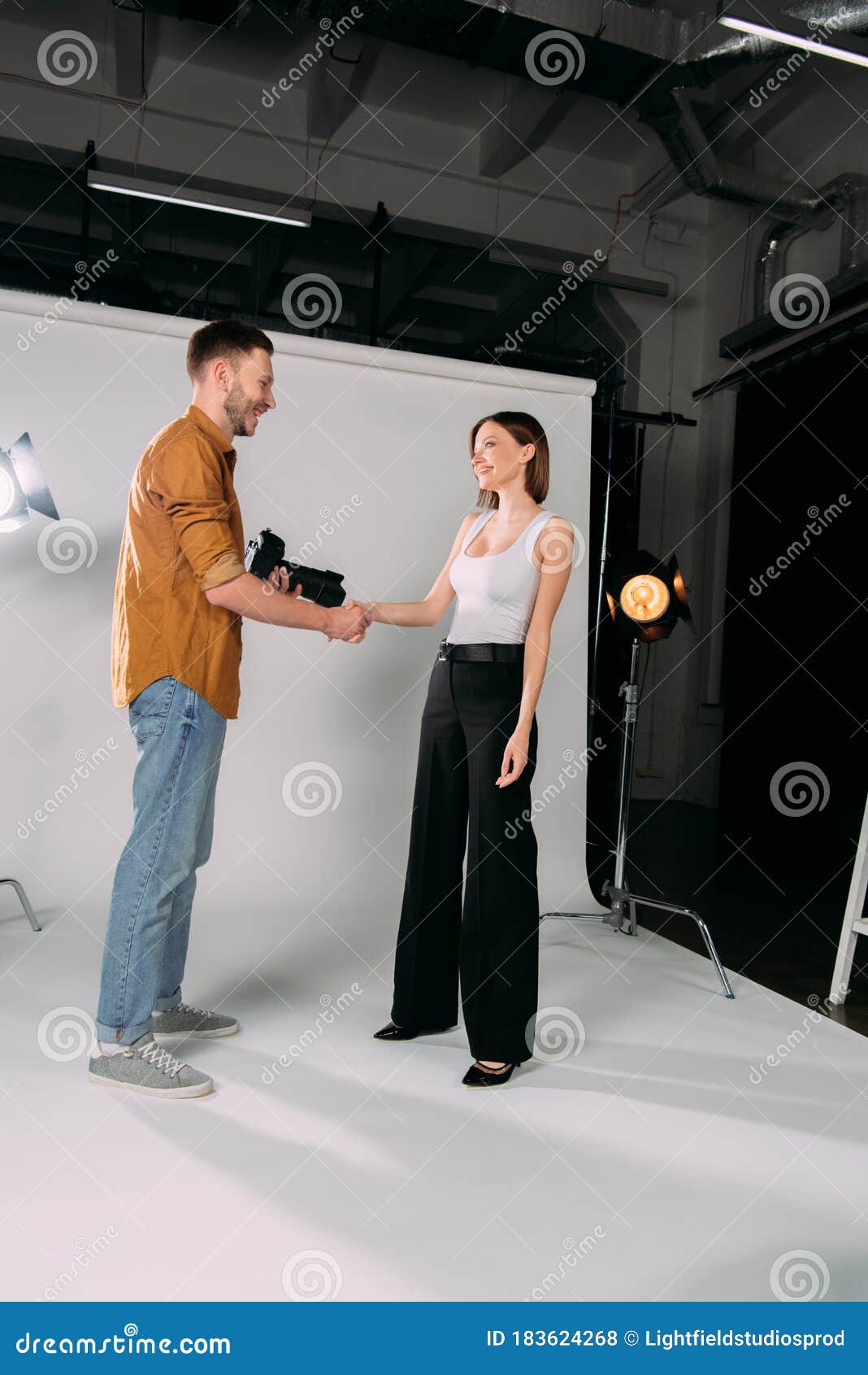 Side View of Smiling Model Shaking Stock Photo - Image of caucasian ...