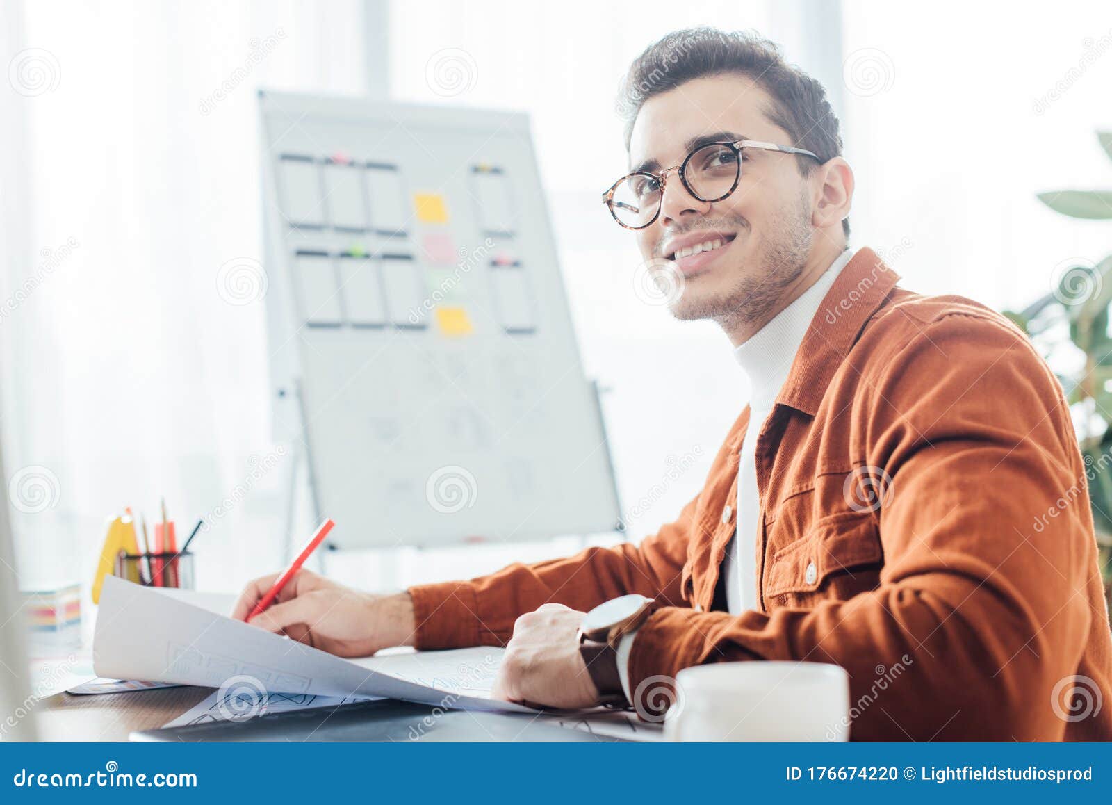 Side View of Smiling Ux Designer Holding Marker while Working with ...