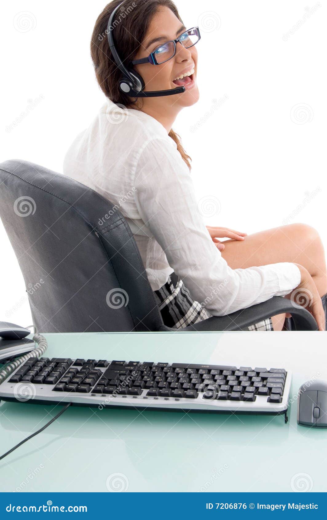 Side View of Smiling Woman Sitting in Office Stock Photo - Image of ...