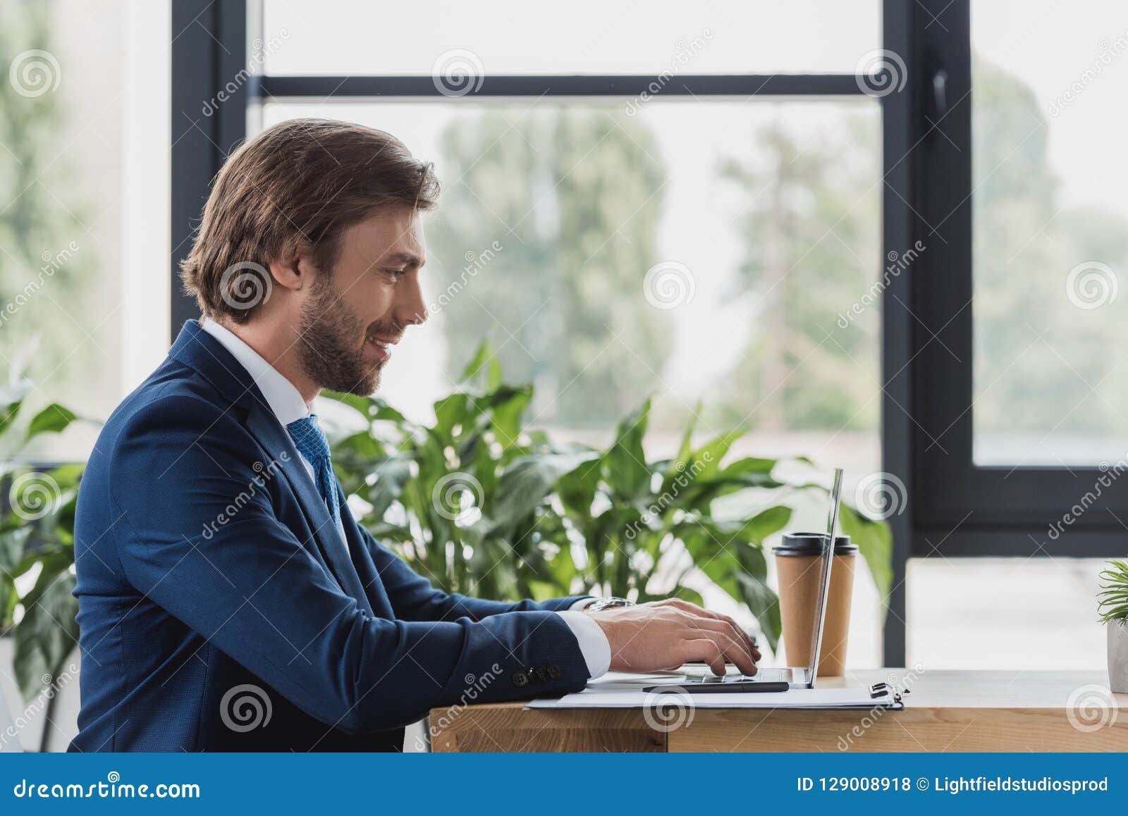 Side View of Smiling Young Businessman Stock Photo - Image of male ...