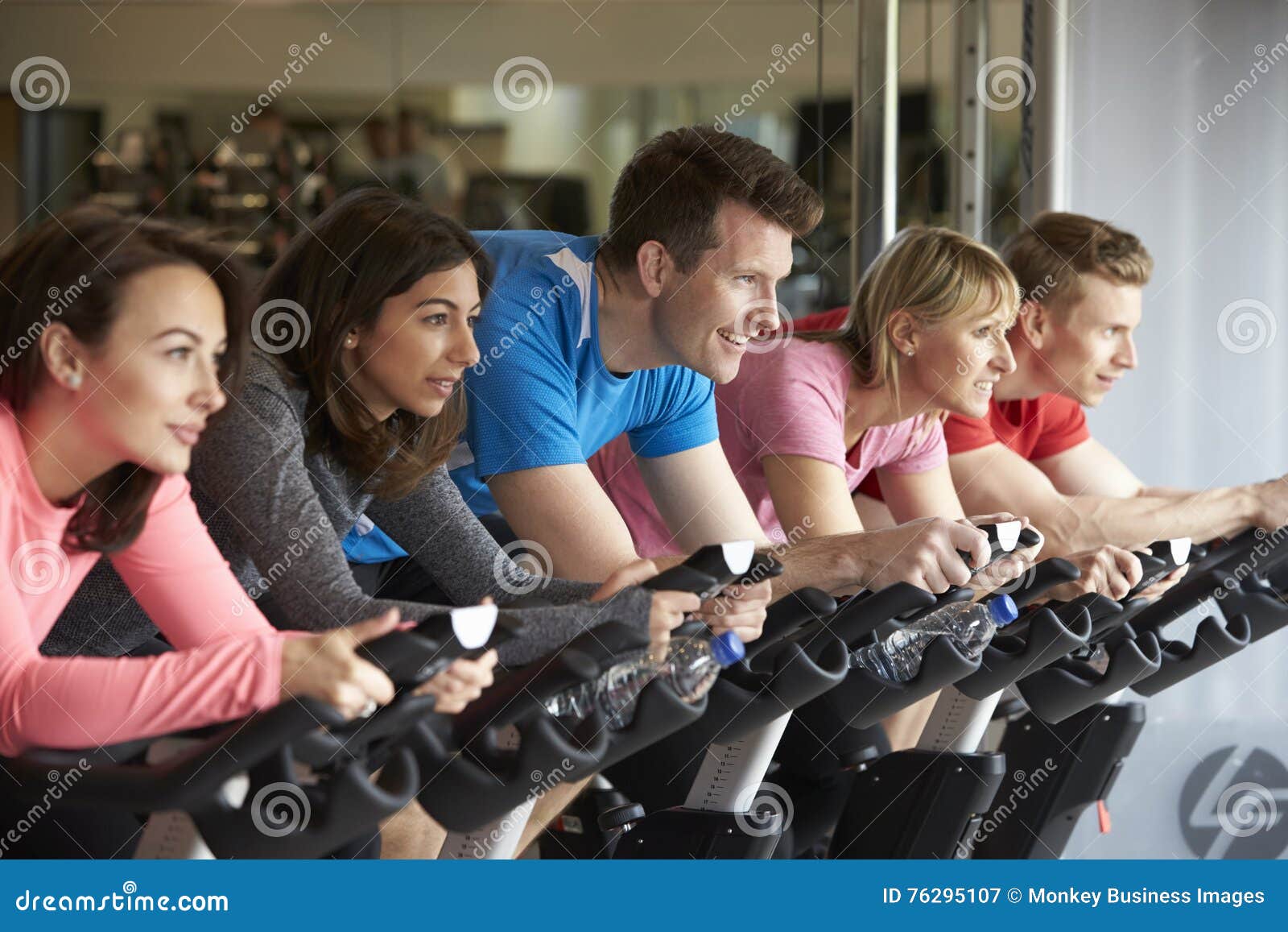 Side View of a Spinning Class on Exercise Bikes at a Gym Stock Image ...
