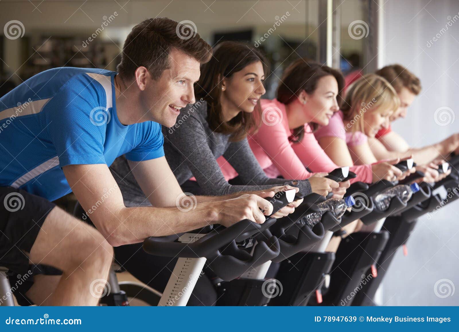 Side View of a Spinning Class on Exercise Bikes at a Gym Stock Image ...