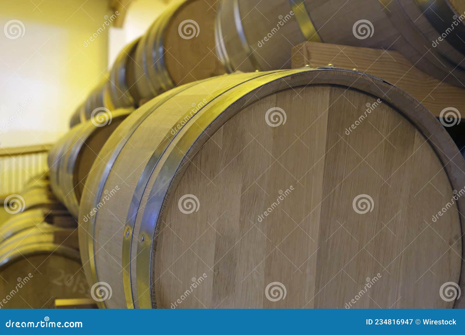 Side View of Stacked Casks at a Whisky Distillery in a Row at the ...