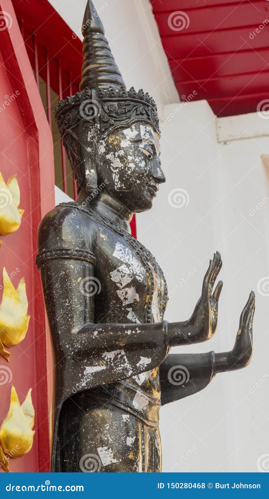 Side View of Standing Thai God with Palms Held Forward Stock Photo ...