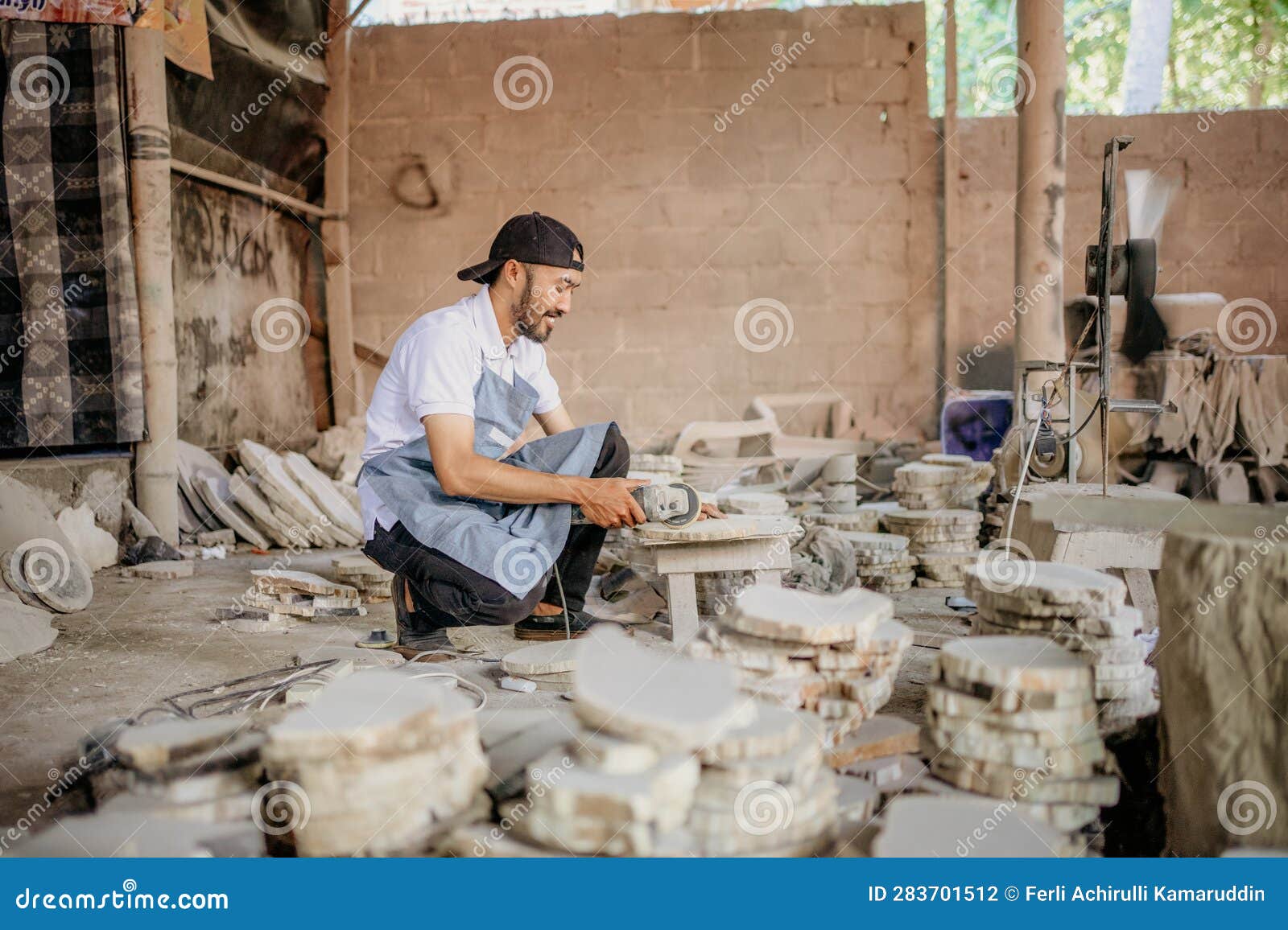Side View of a Stone Craft Worker Squatting while Cutting Stones Stock Photo - Image of model ...