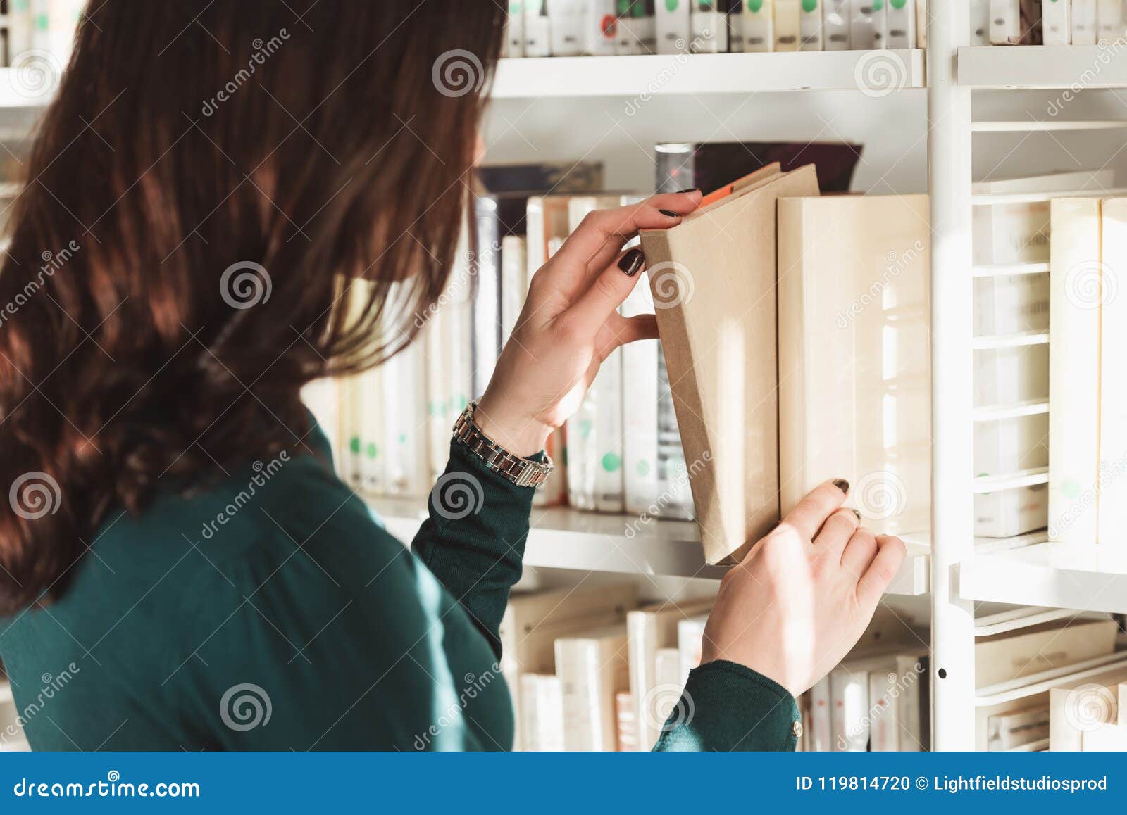 Side View of Student Taking Book from Shelves Stock Photo - Image of ...