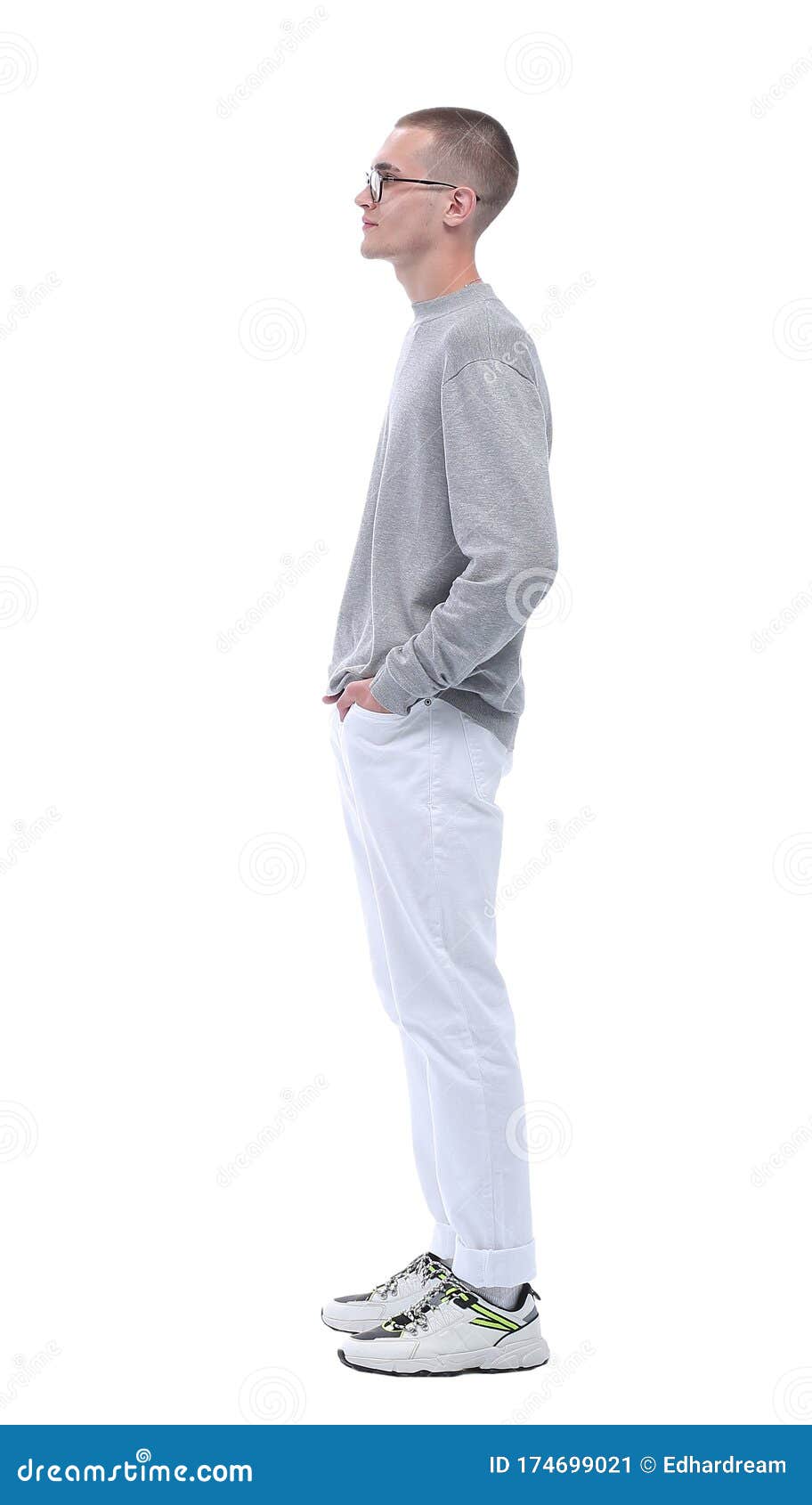 Side View. Stylish Guy in Glasses Reading Something on a White Wall ...