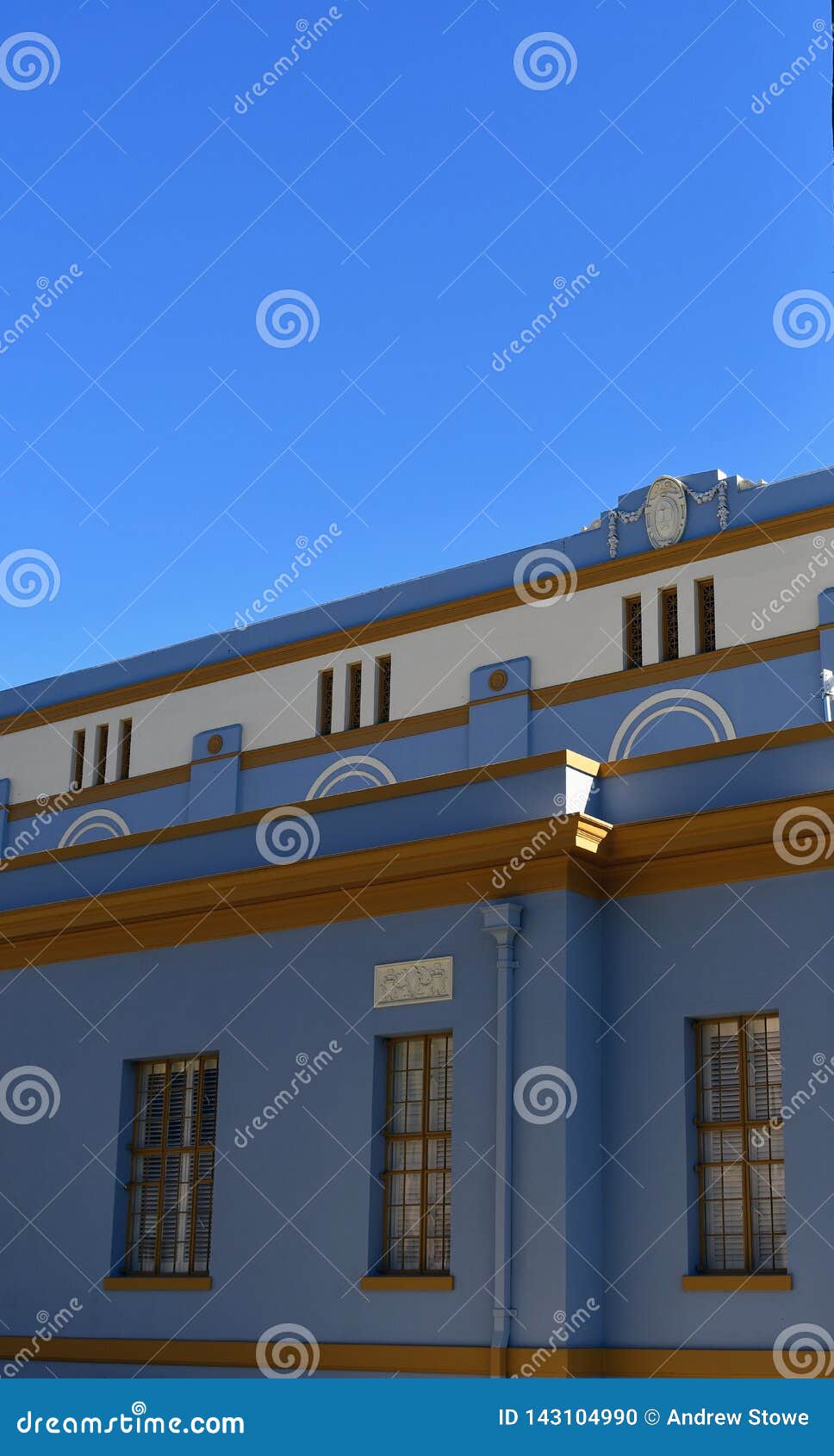 Side View of Tall Building with Rectangular Windows Reflecting Bright ...
