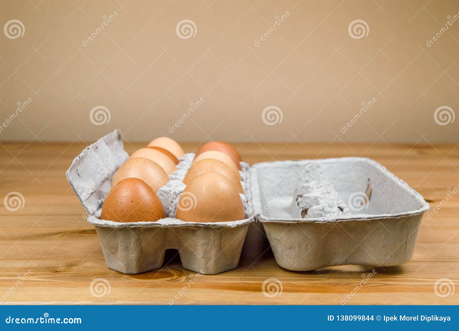 Side View of Ten Hen Eggs in a Carton Box on a Table with Copy Space ...