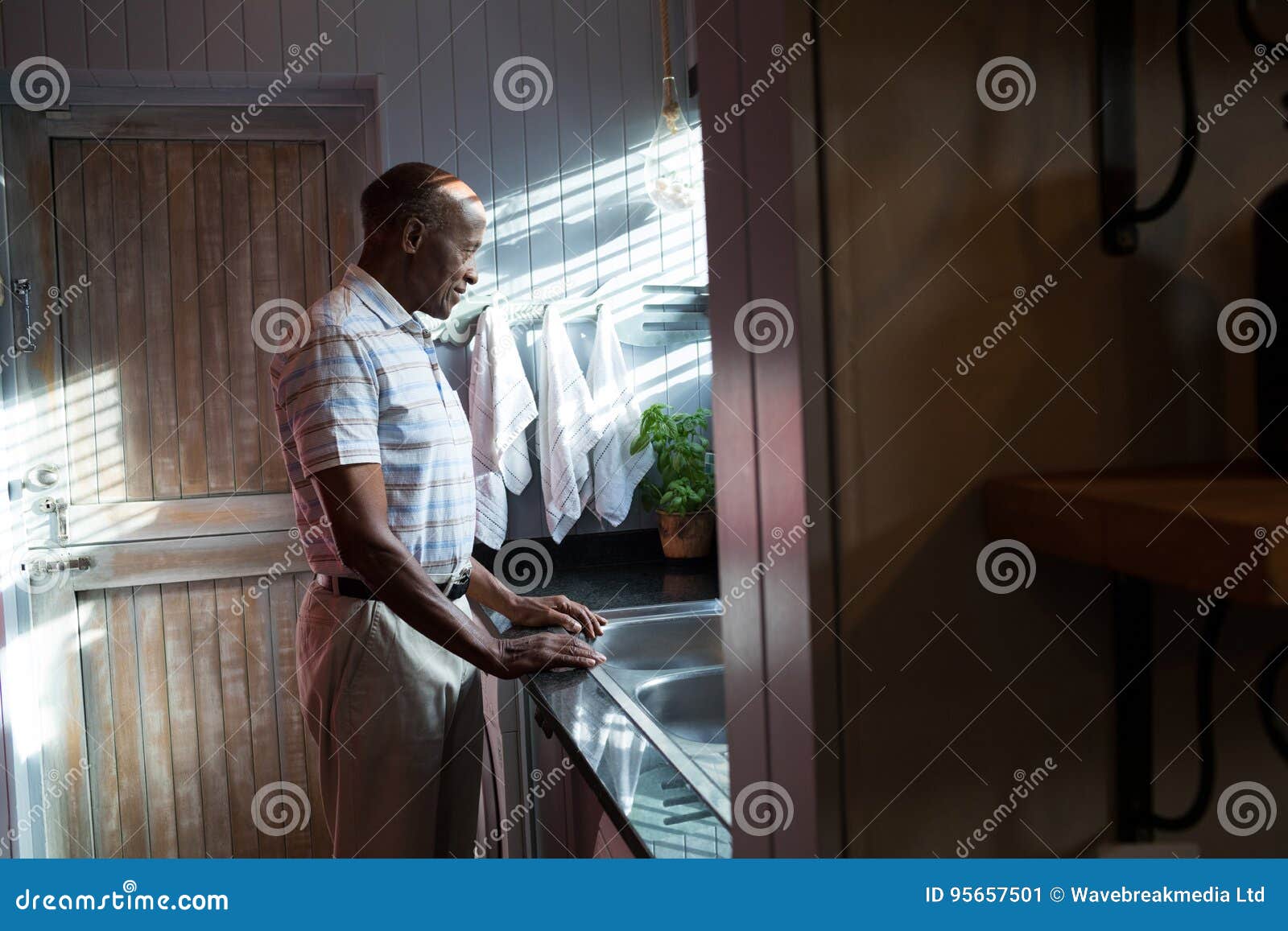 Side View of Thoughtful Man Standing by Sink Stock Image - Image of ...