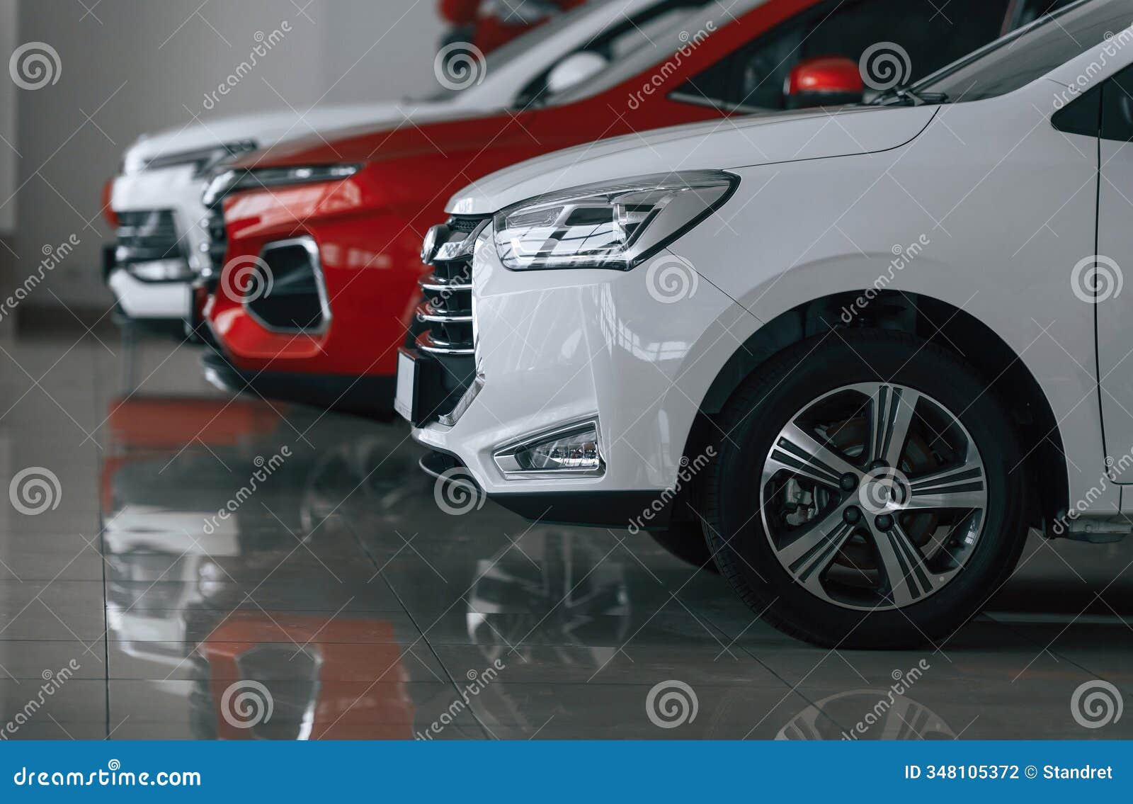 Side View of Three Cars that are Parked in the Auto Salon Stock ...