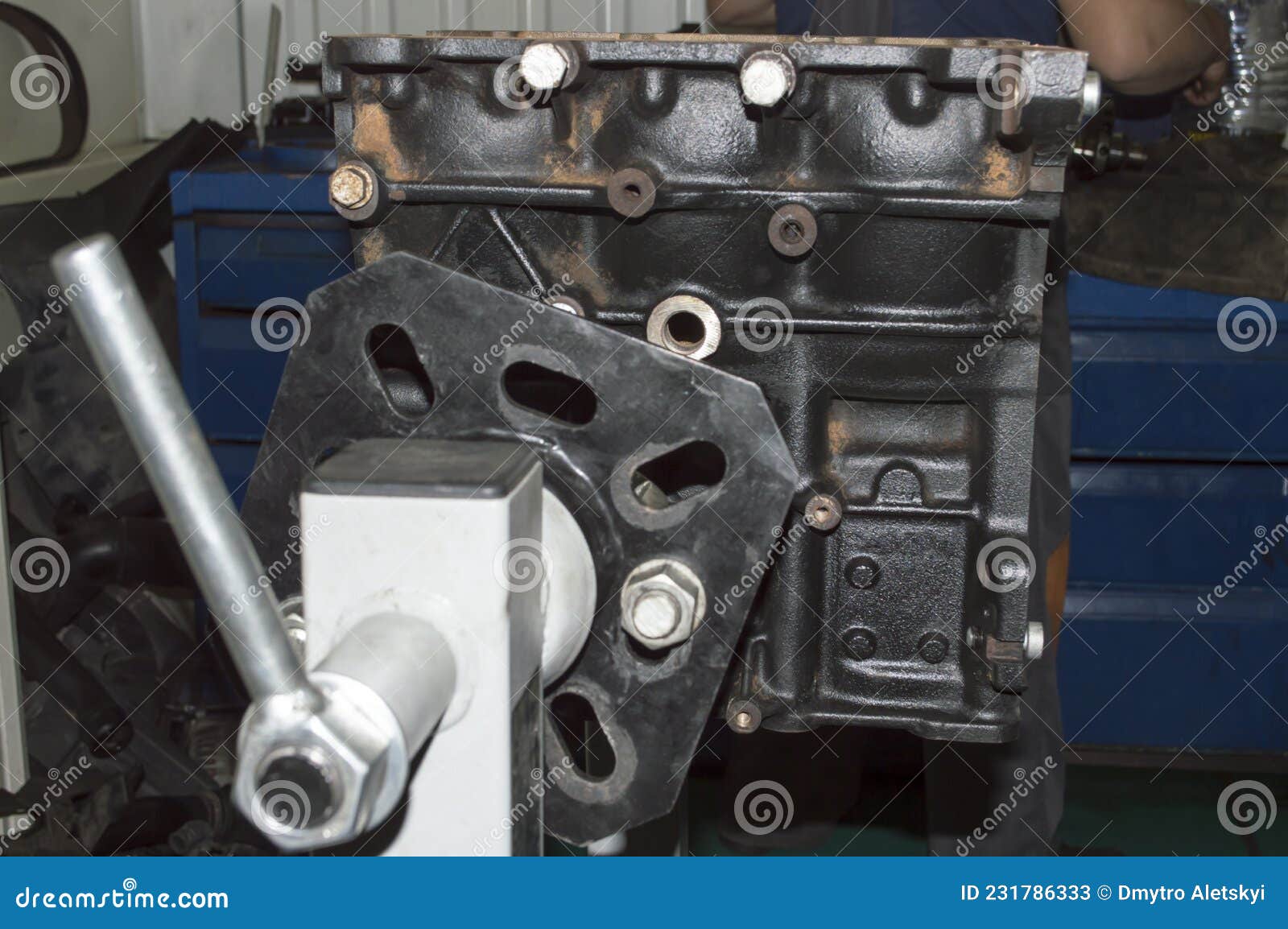 The Three-cylinder Engine Block is Fixed on the Engine Repair Stand ...