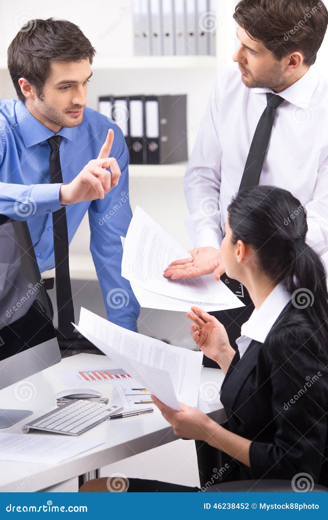 Side View of Three People Working on Computer at Office Stock Photo ...