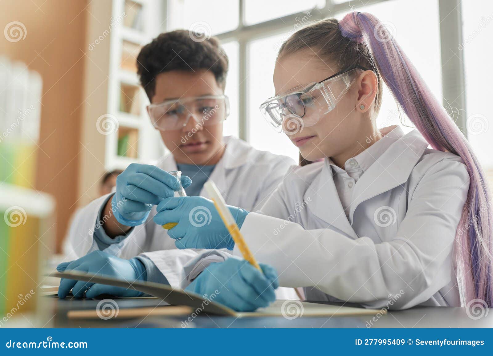 Side View Two Children Enjoying Experiments during Science Class in ...