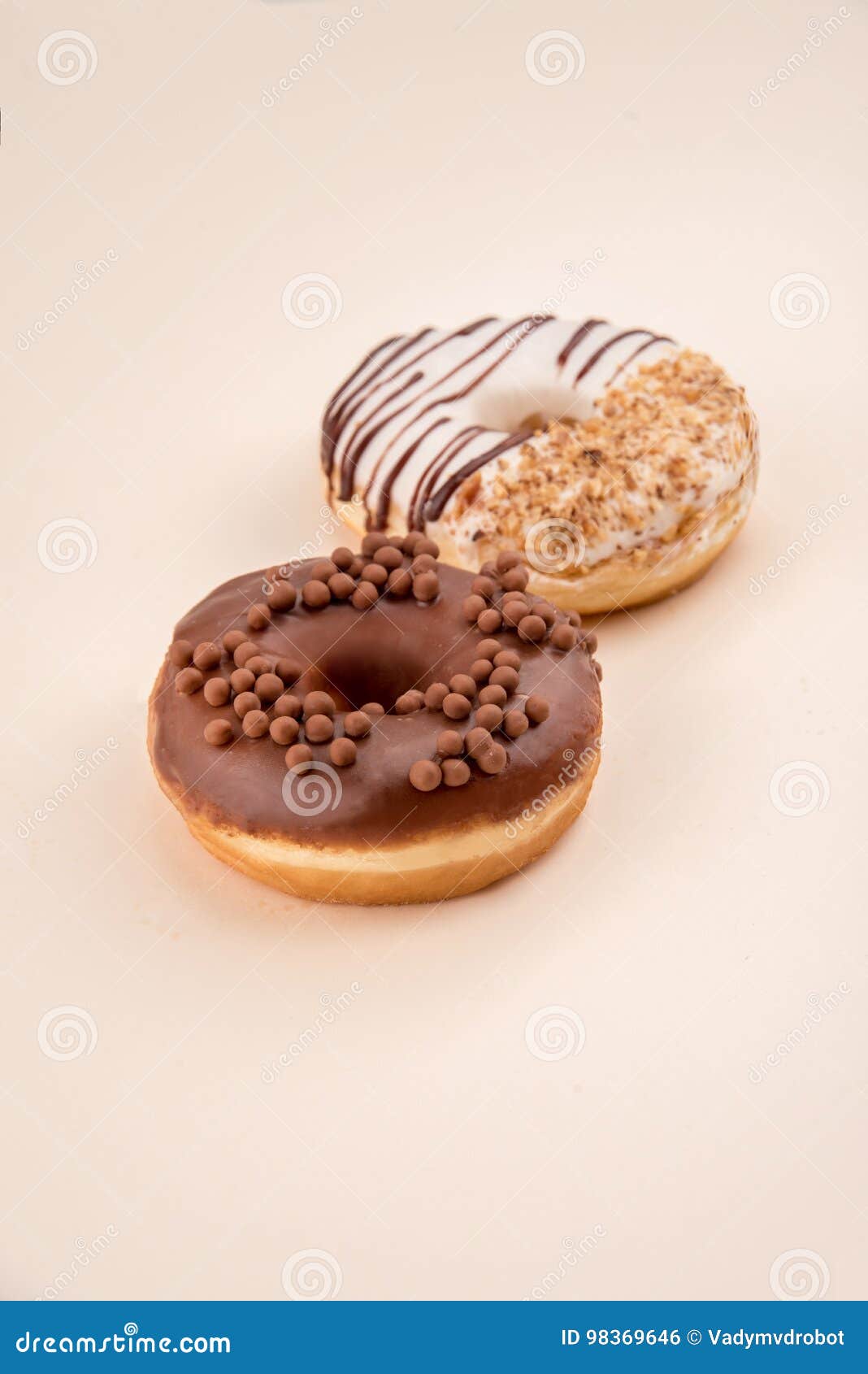 Side View of Two Donuts Isolated Over White Stock Photo - Image of ...